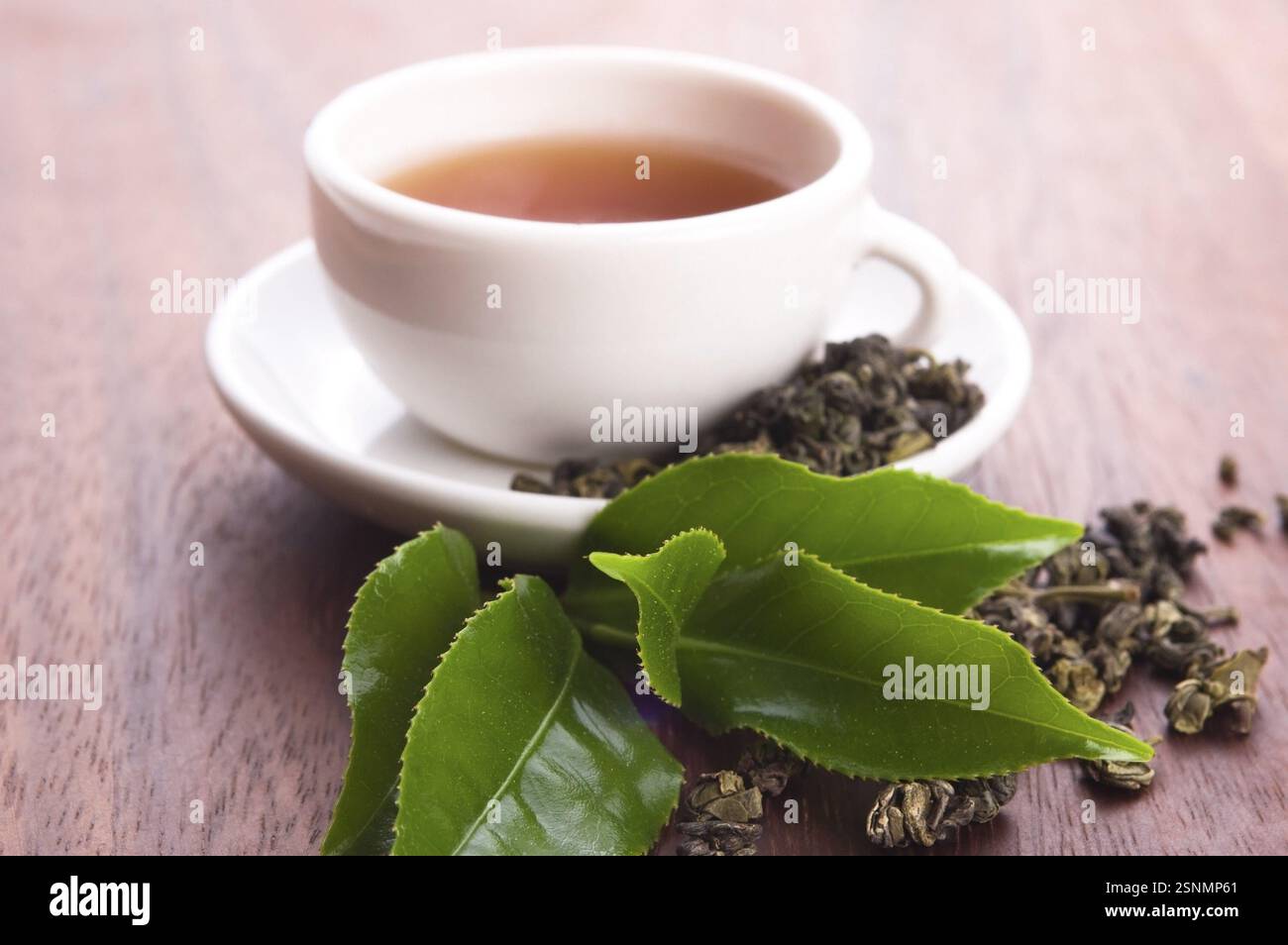 Cup of green tea with freh leaves, lodz, poland Stock Photo - Alamy