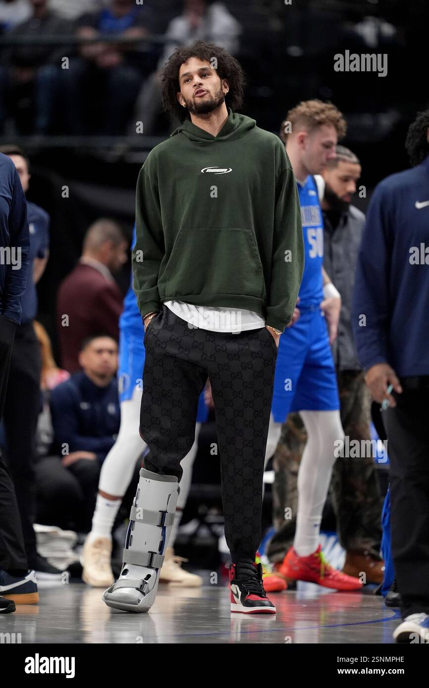 Dallas Mavericks' Dereck Lively II wears a boot on his right foot as he ...