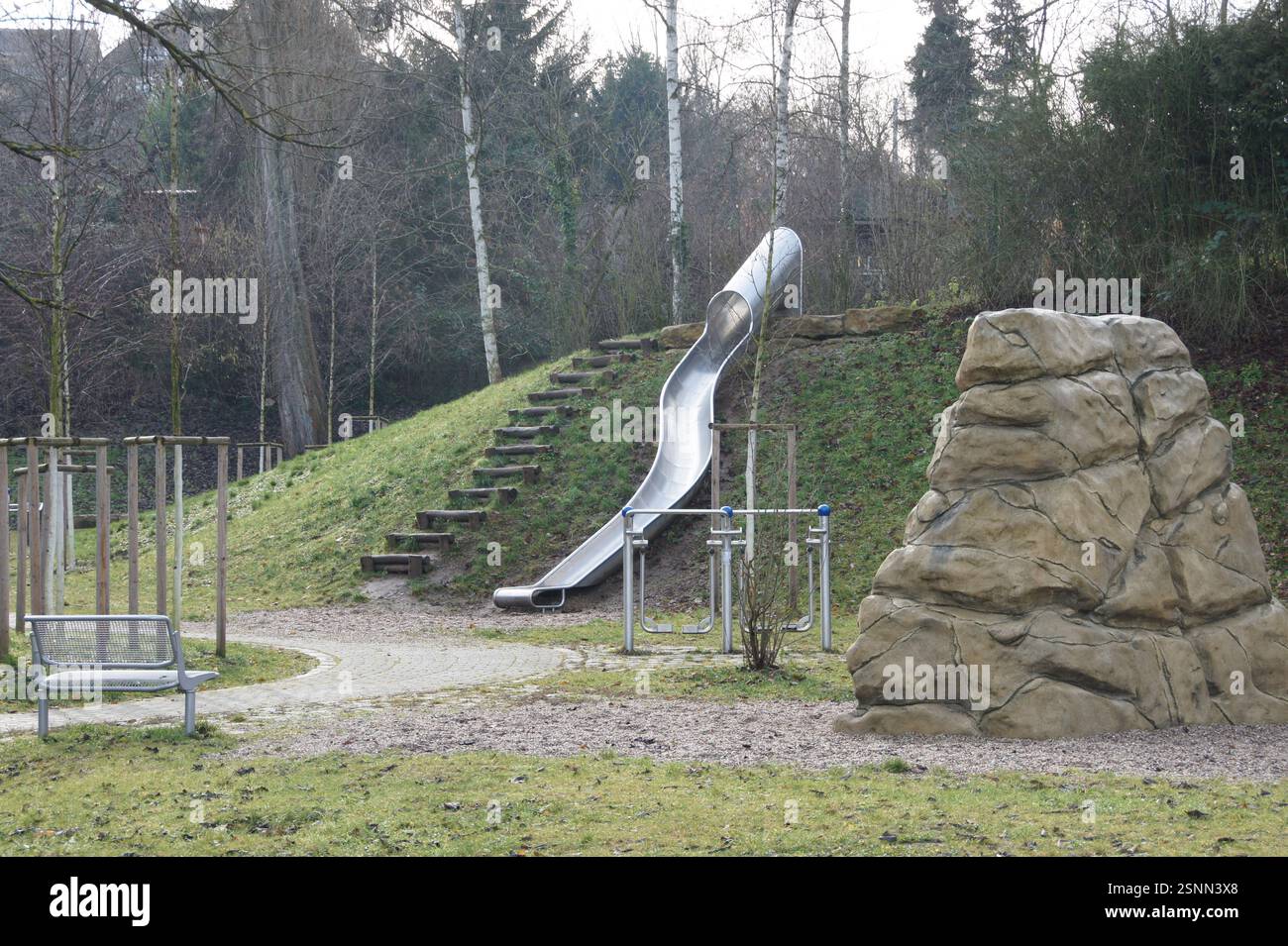 A popular playground equipment for children: a stainless steel slide in ...