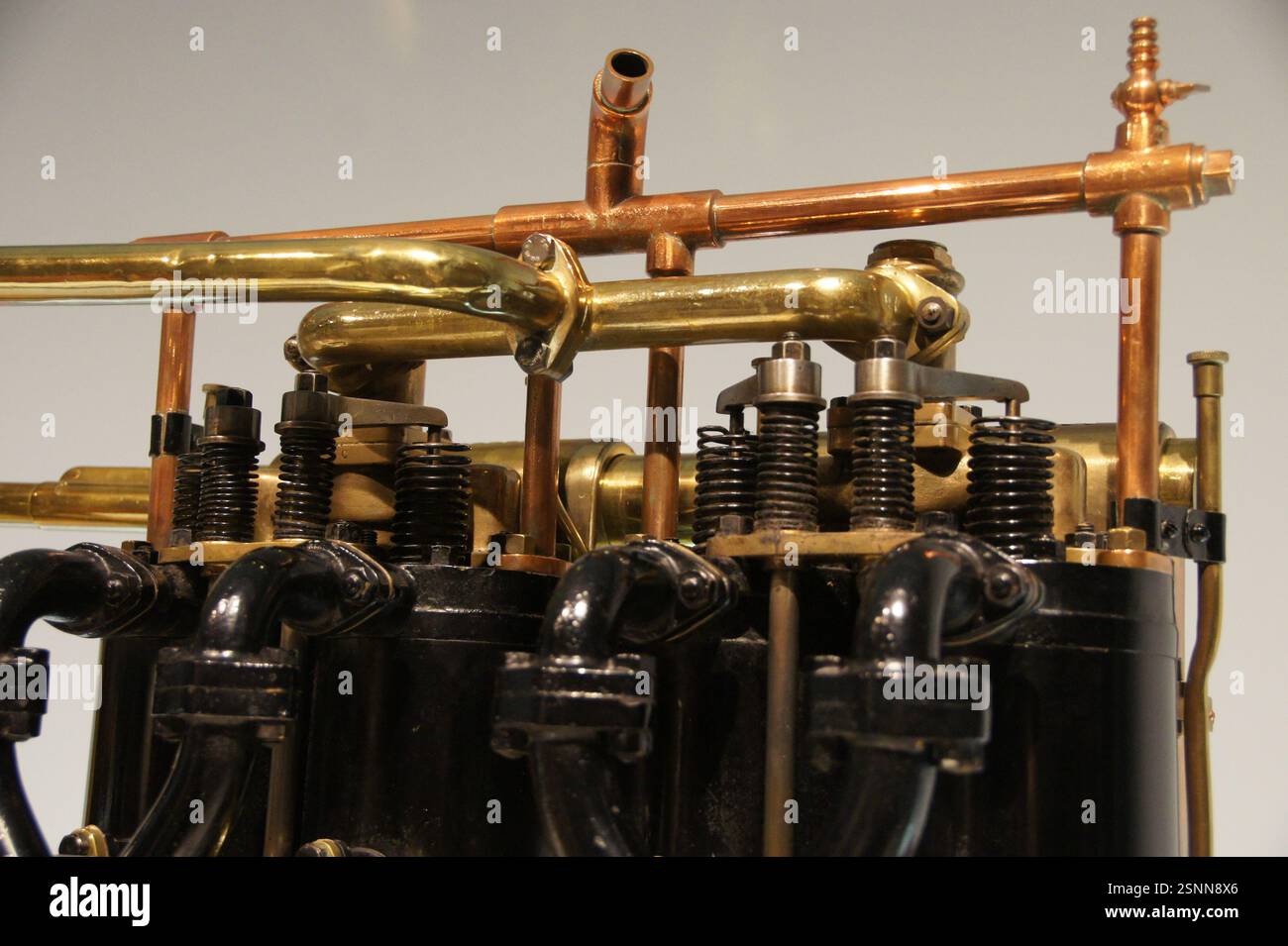 A close-up of a vintage car engine in Germany, Munich reveals polished ...