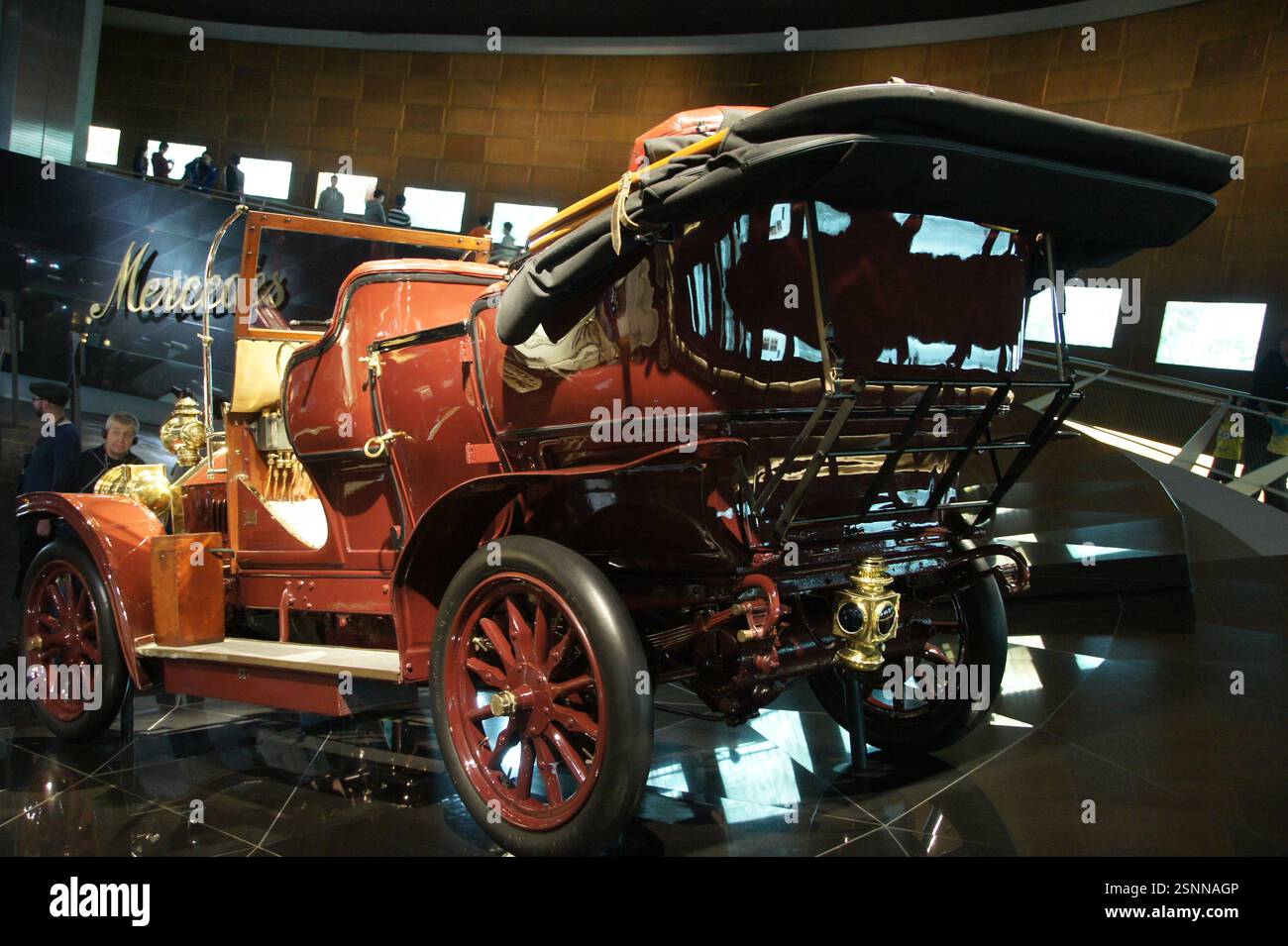 A classic red Mercedes-Benz is on display at the Mercedes-Benz Museum ...