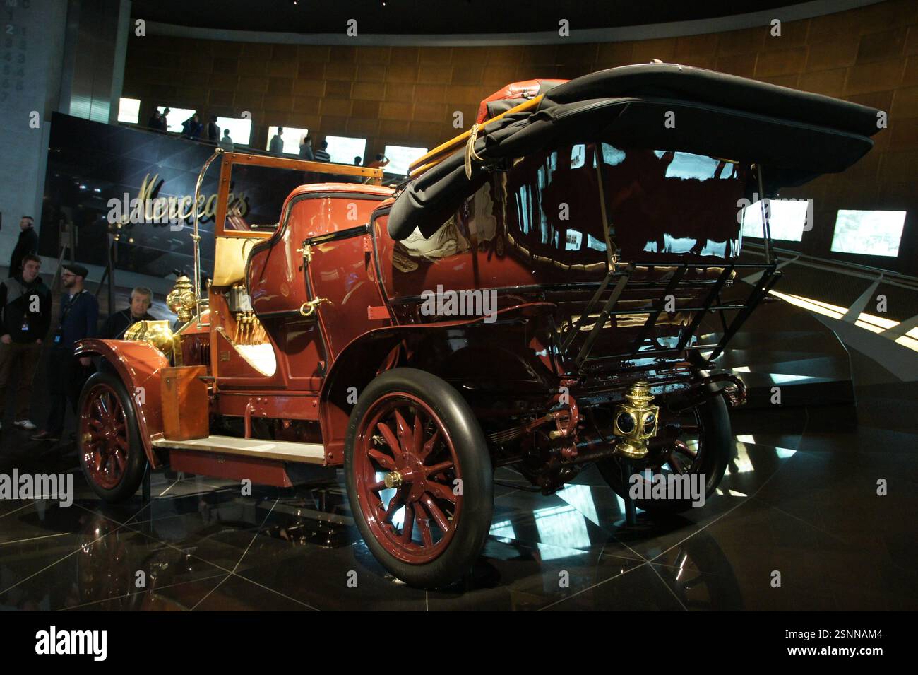 A classic red Mercedes-Benz 18 PS is on display at the Mercedes-Benz ...
