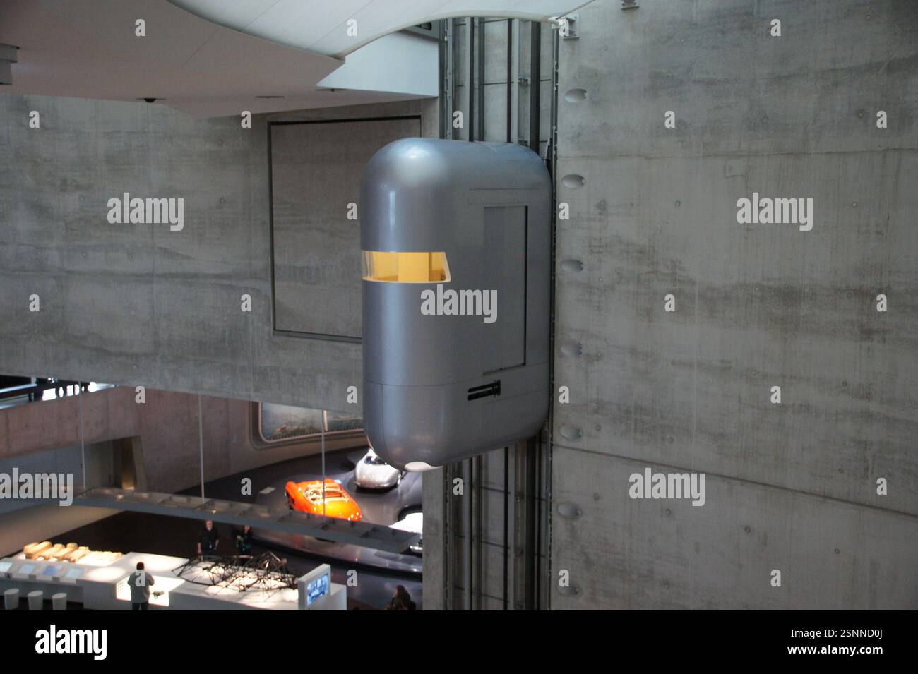 A small elevator mounted on a building wall in Germany, Munich. This ...