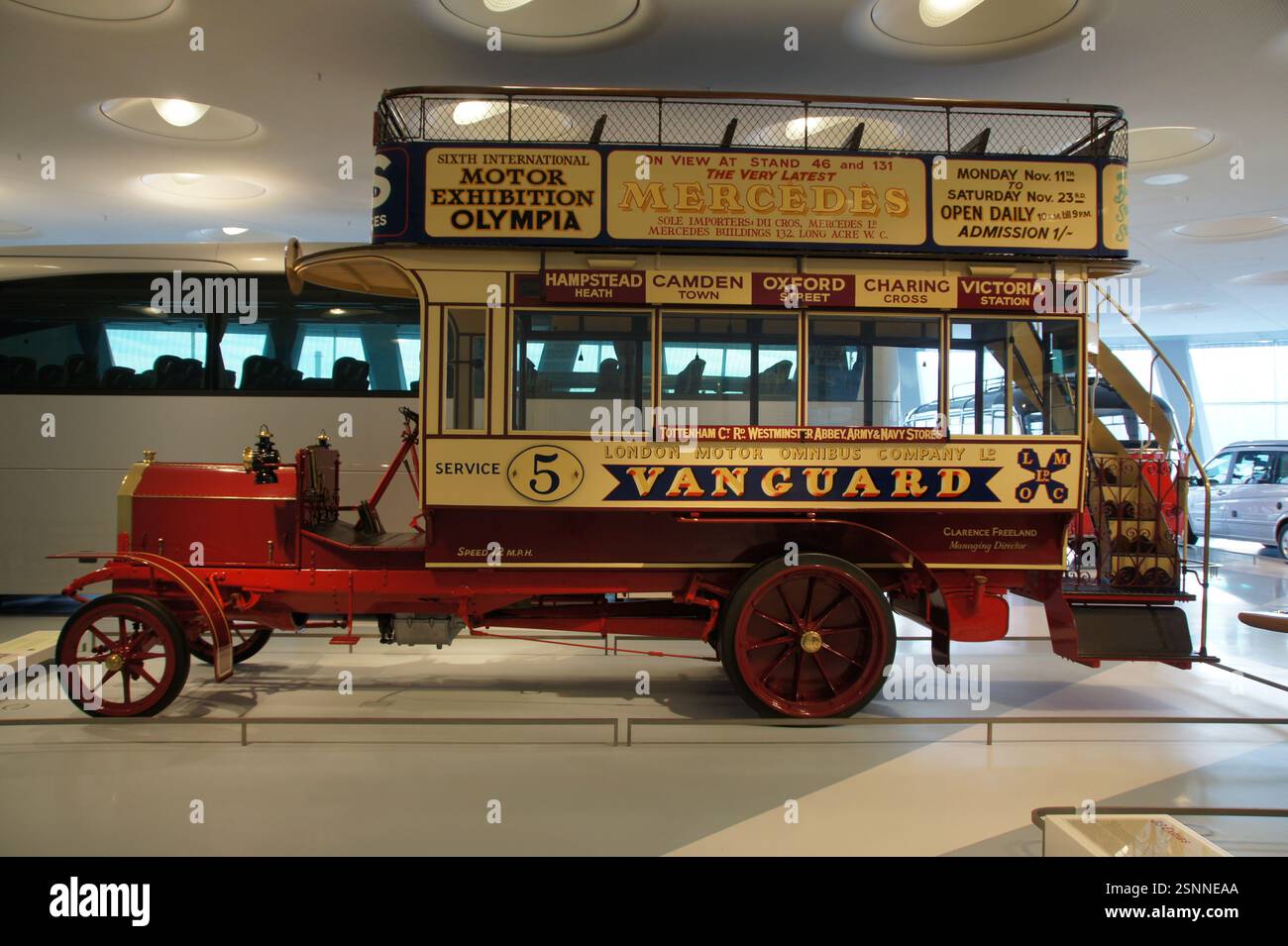 Vintage double-decker bus with open top travels through Germany, Munich ...