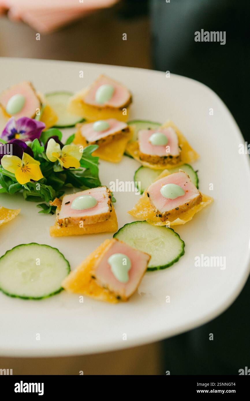 Colorful gourmet appetizer showcases fresh cucumber slices with vibrant ...