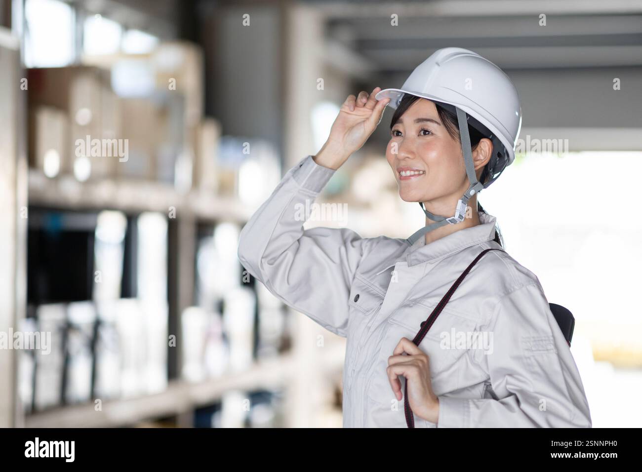 Portrait of woman in work clothes Stock Photo - Alamy