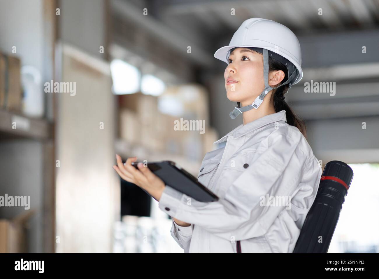 Portrait of woman in work clothes Stock Photo - Alamy