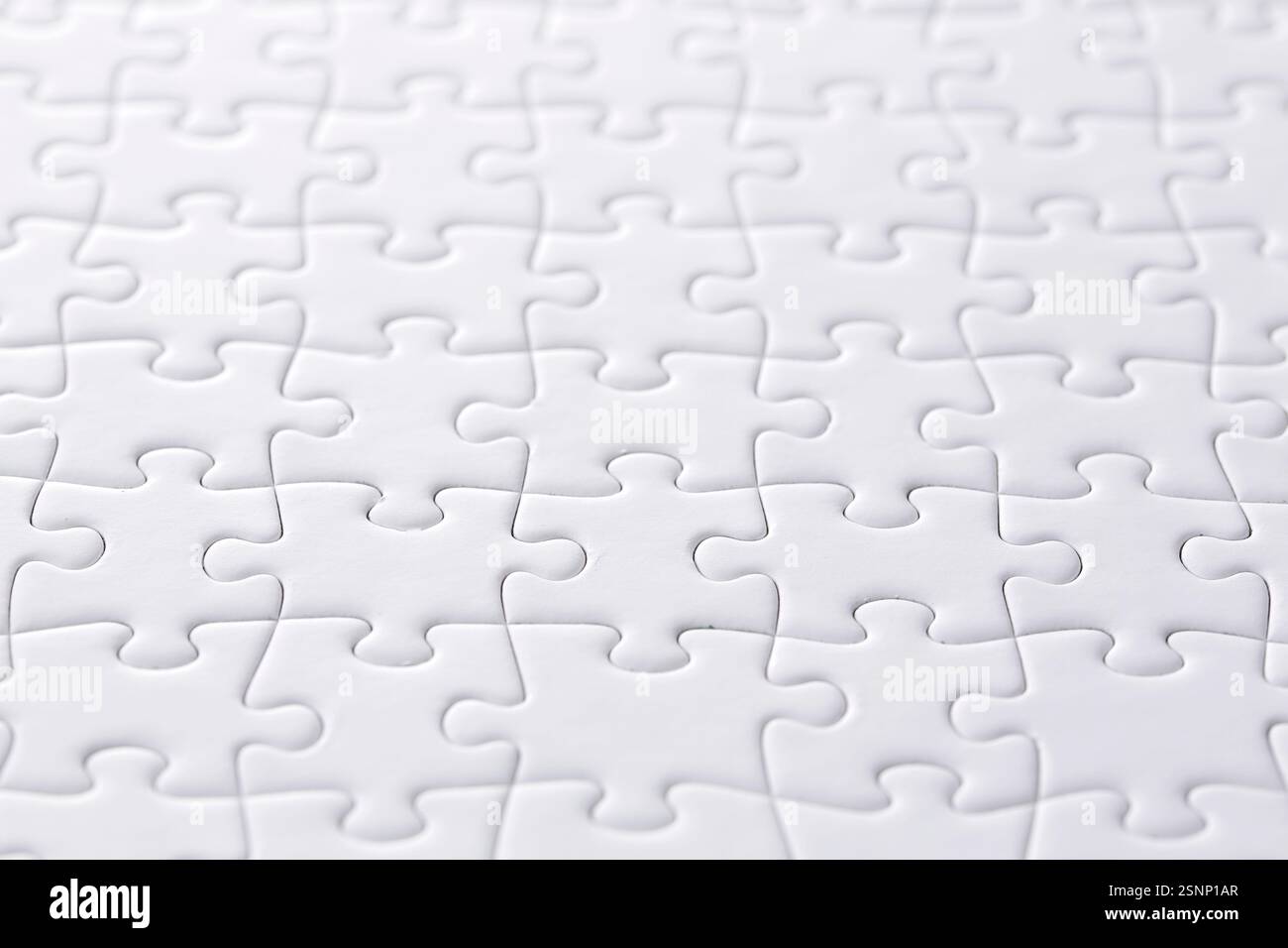 White jigsaw puzzles Stock Photo - Alamy