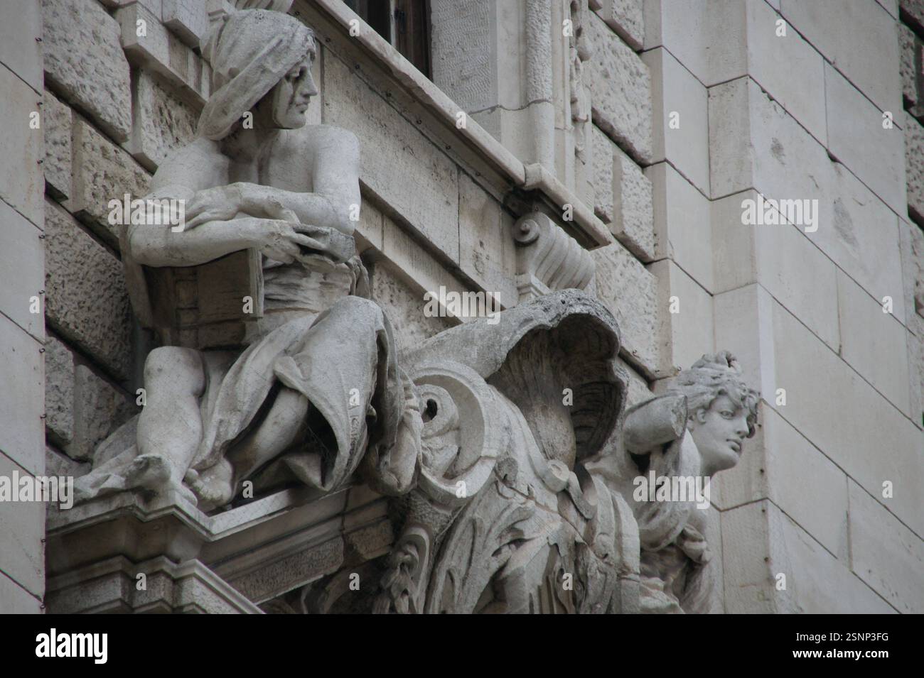 Germany, Munich. Stone facade with ornate sculptures depicts intricate ...