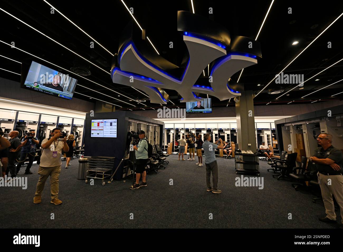Members of the media look around the New York Yankees clubhouse during ...