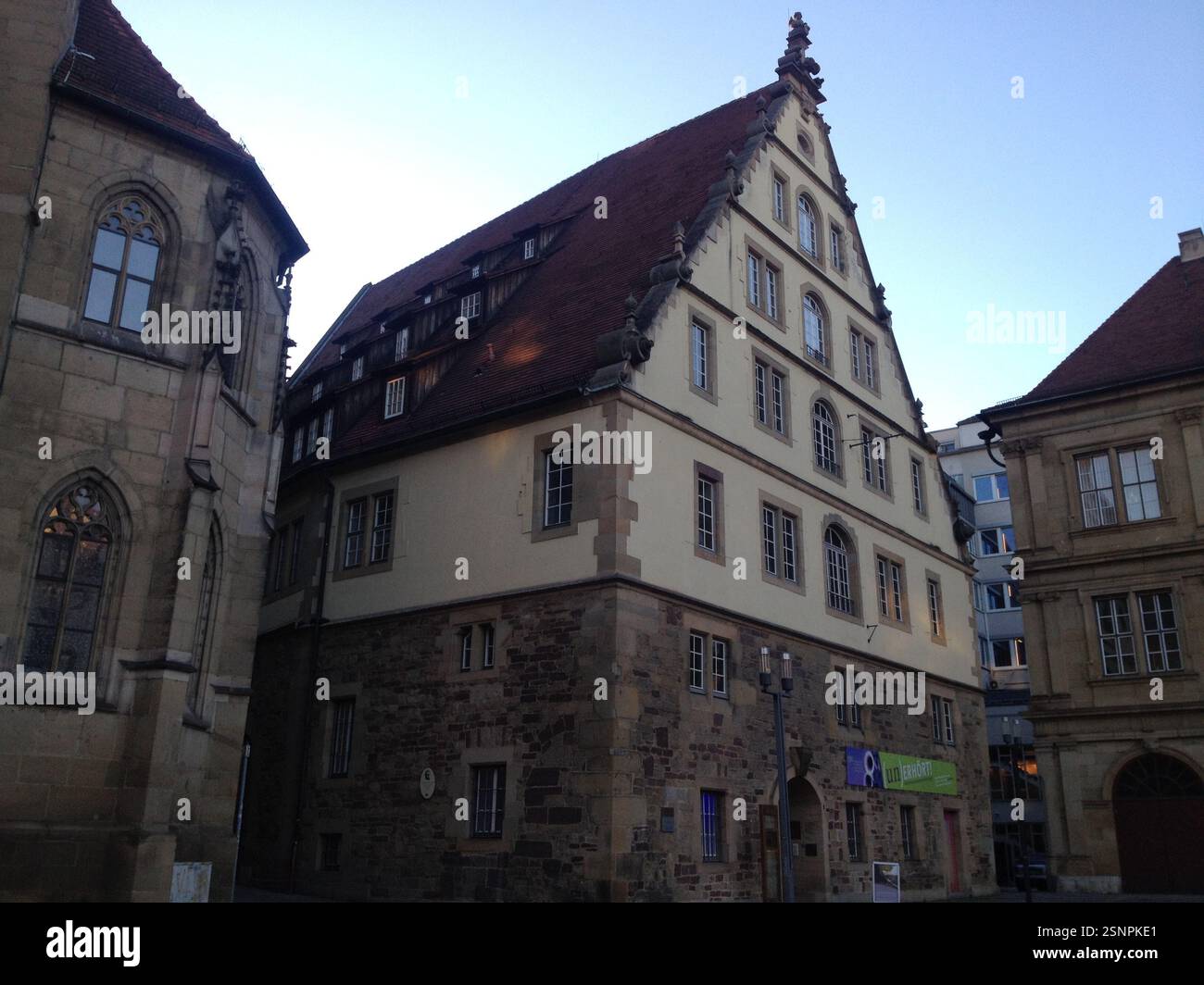 Medieval-style building with steep roof and stone facade. Located in ...