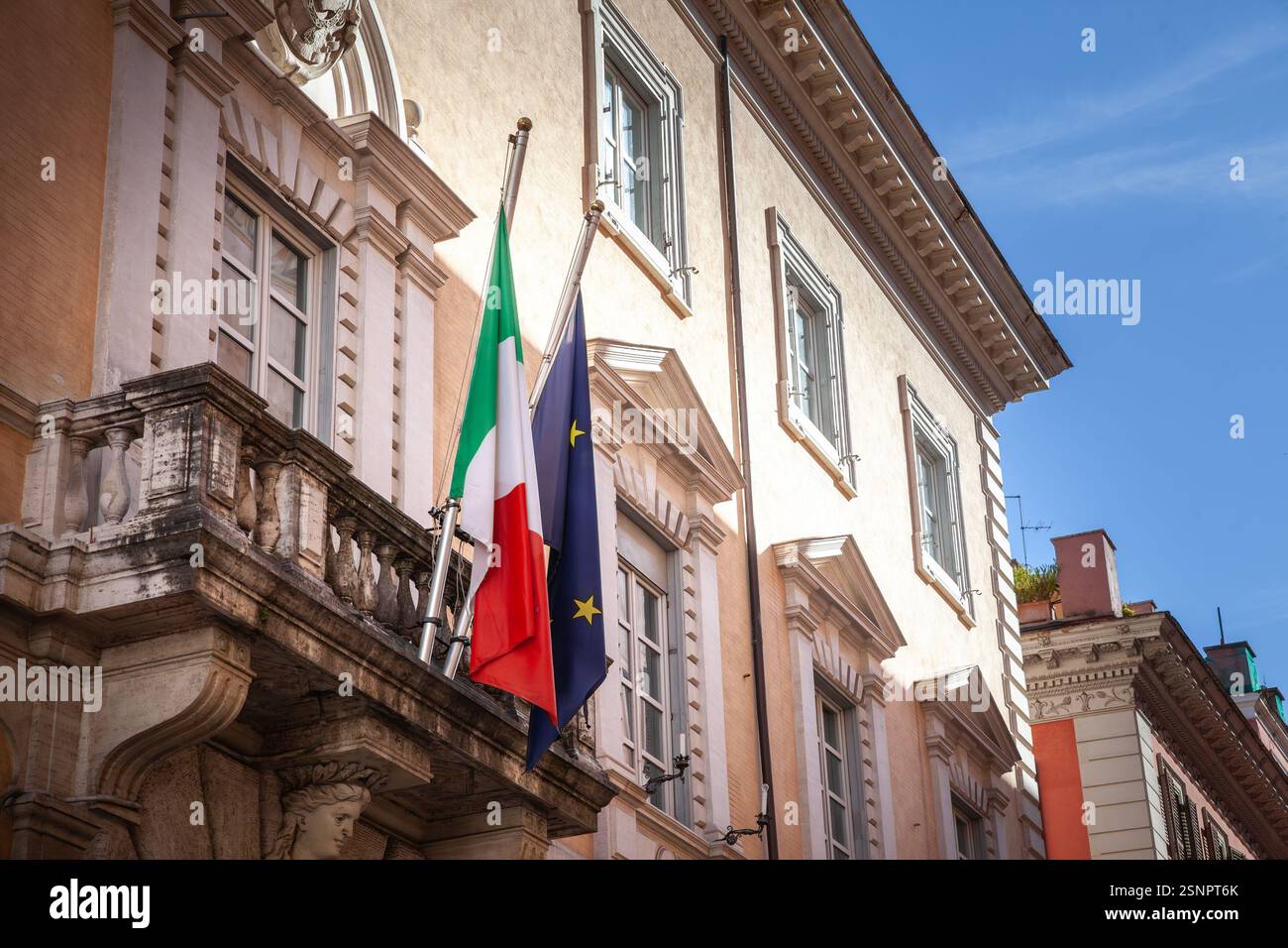 Italian & European Union flags in a typical narrow street in old Rome ...