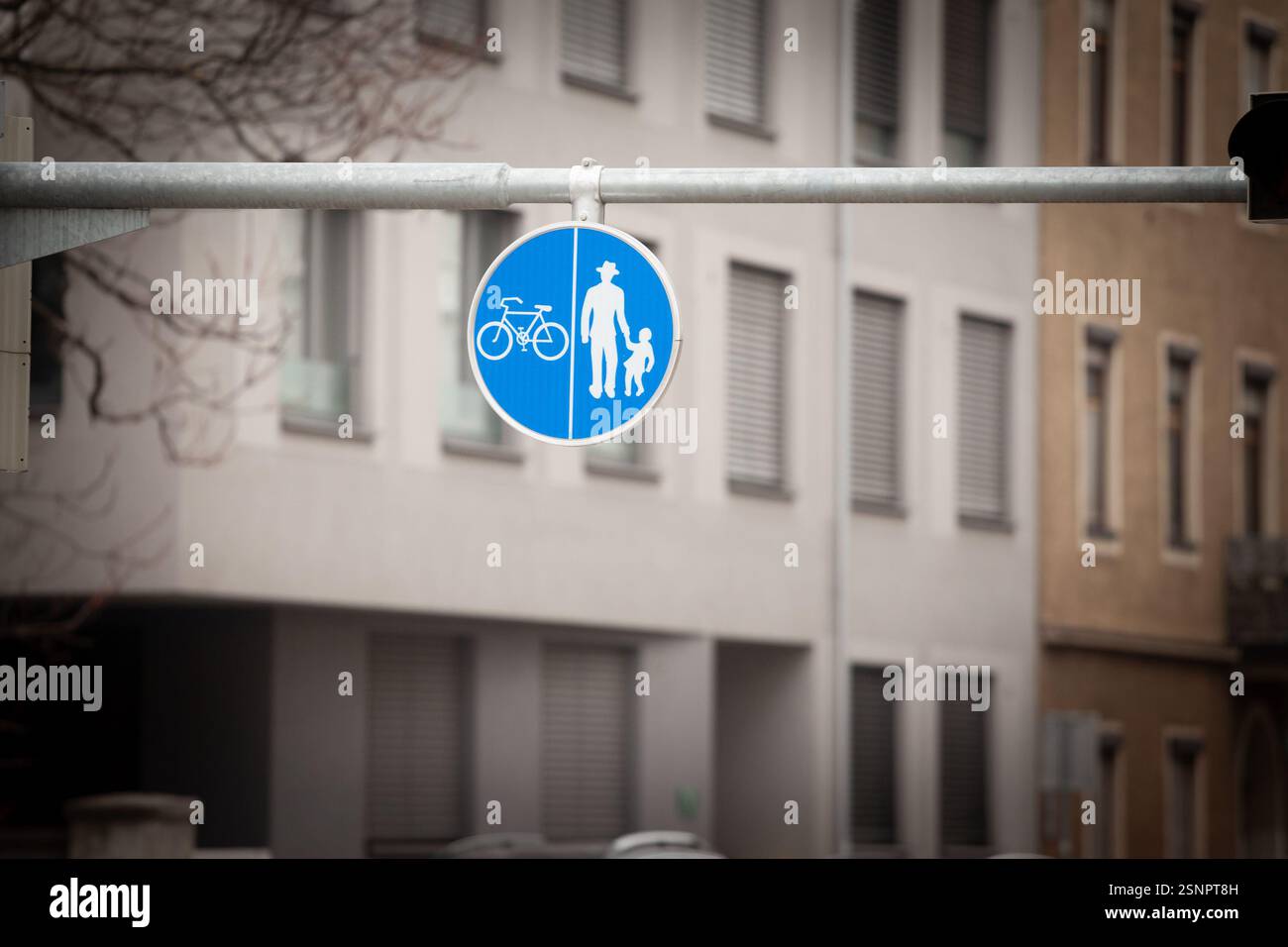 A blue 'Gemeinsamer Geh und Radweg' sign (shared pedestrian and bicycle ...