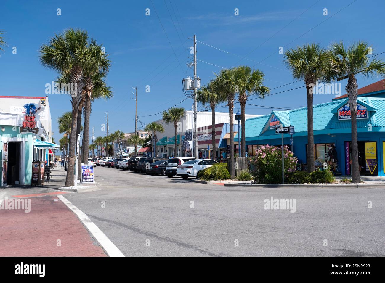 View looking down Tybrisa Street on Tybee Island, Georgia on a sunny ...