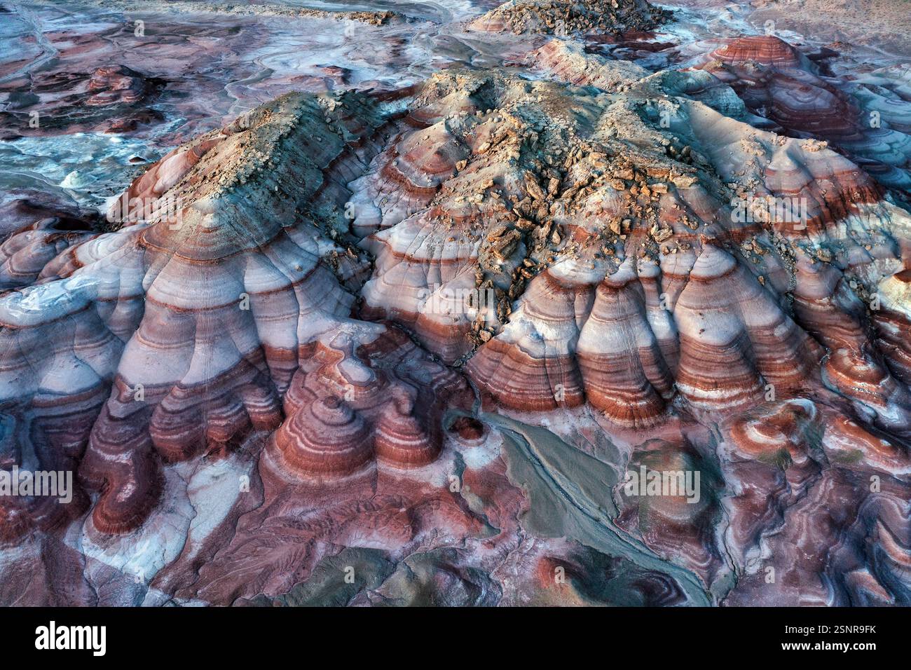 Aerial view of the Bentonite Hills after sunset showing the multi ...