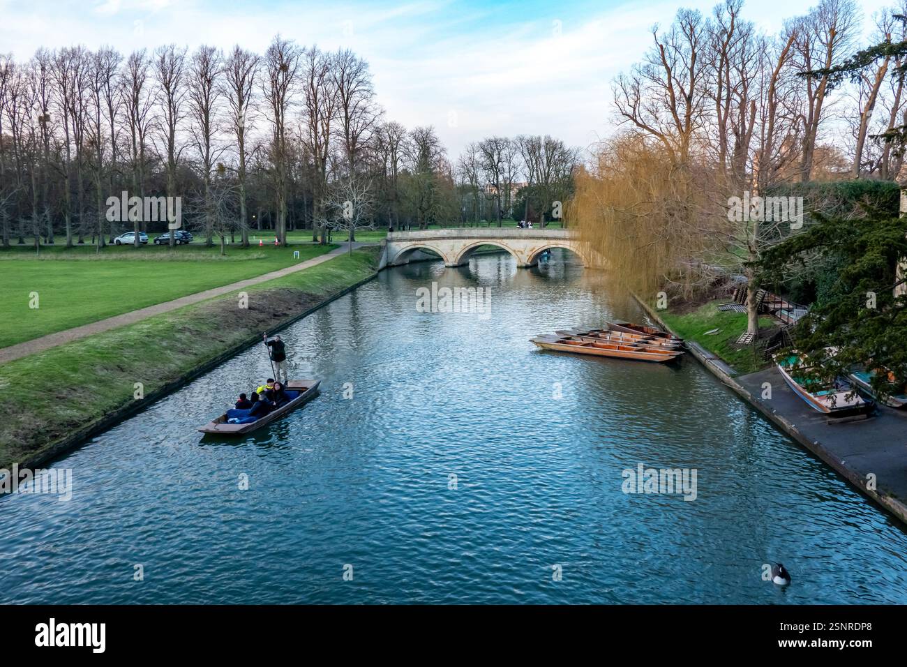 eople enjoy punting on the River Cam in Cambridge, England, with a ...