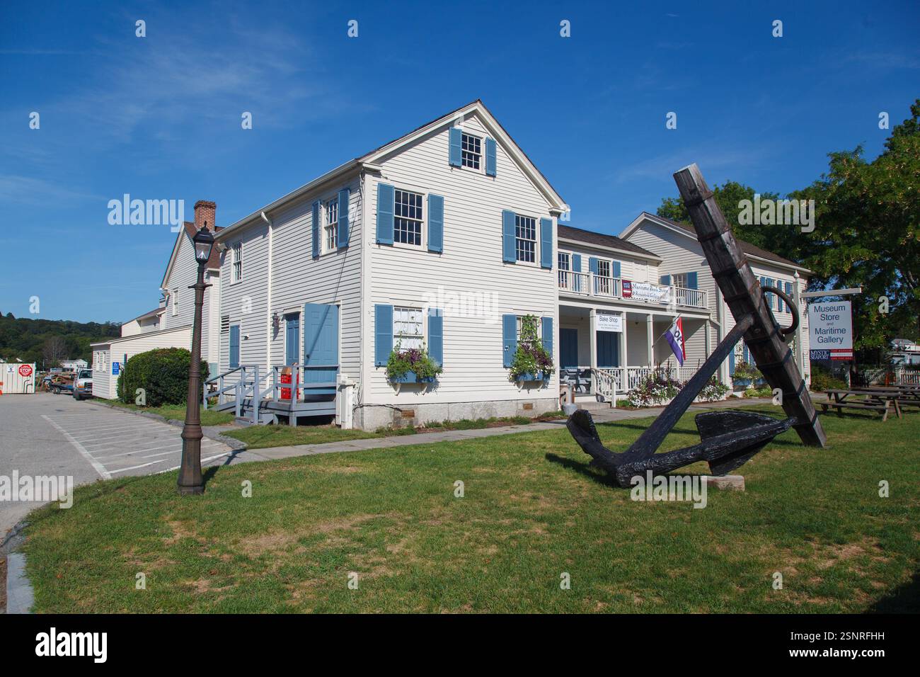 The Mystic Seaport museum historic wood house and a boat anchor ...