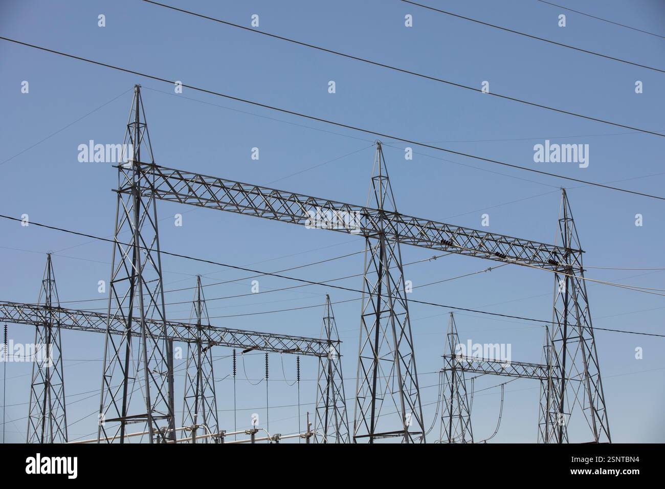 Sunny daytime view of power lines of an electrical substation in ...
