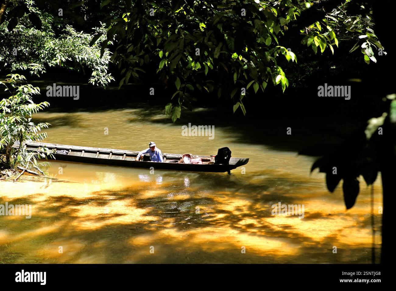 Ramping, an elder, waiting on a boat during an ecotourism event in ...