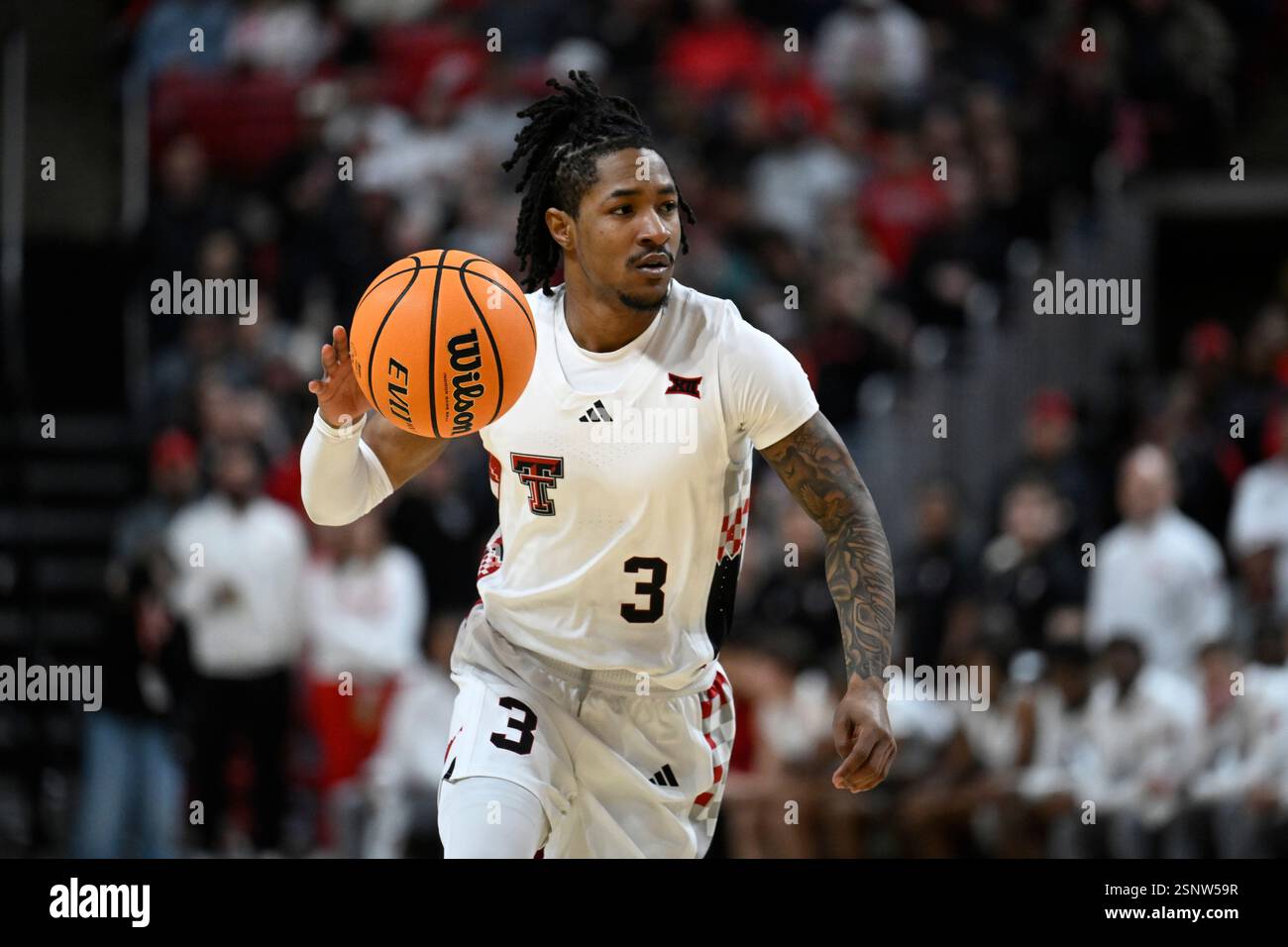 Texas Tech guard Elijah Hawkins (3) brings the ball up court against ...