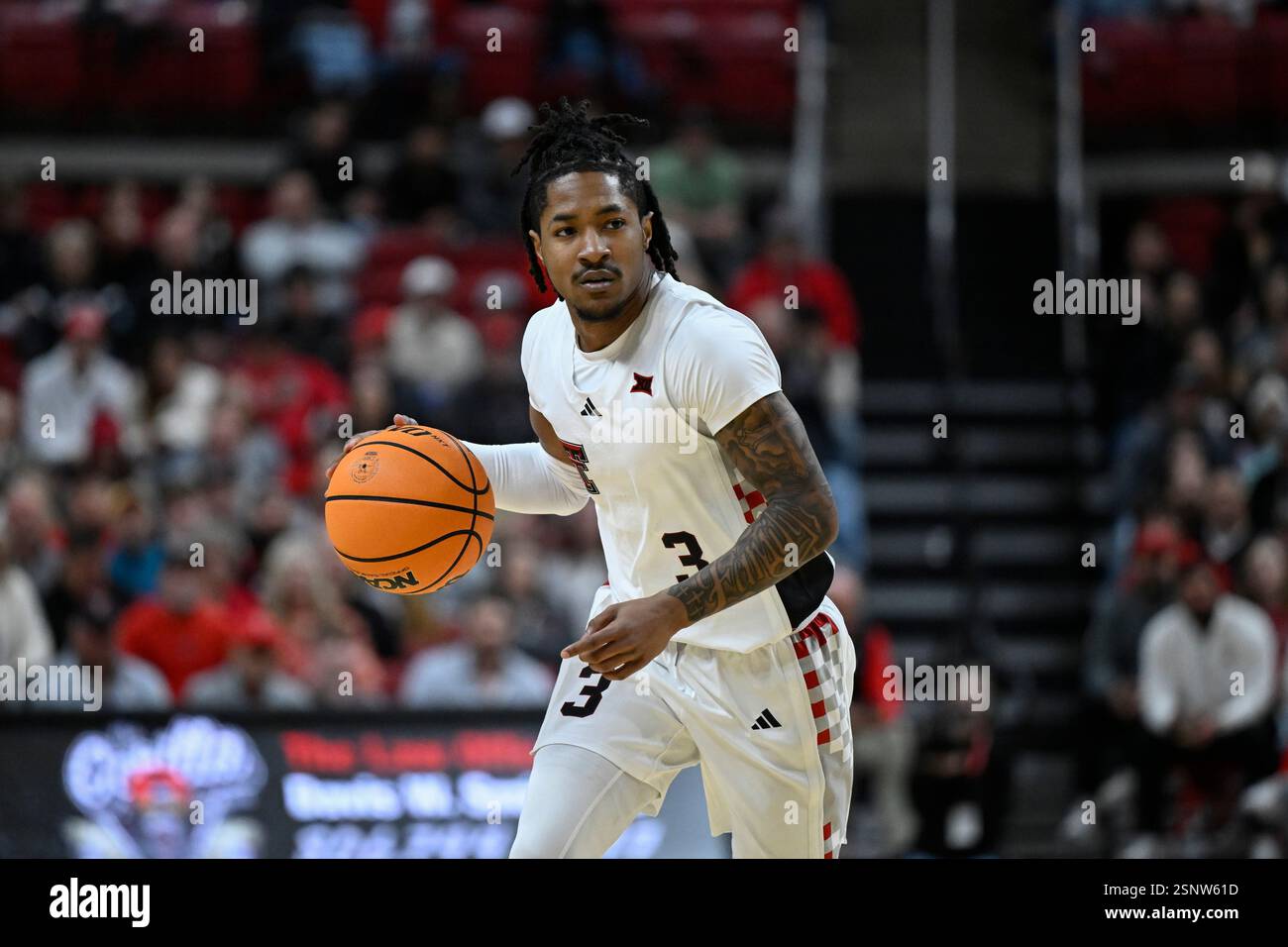 Texas Tech guard Elijah Hawkins (3) controls the ball against Arizona ...