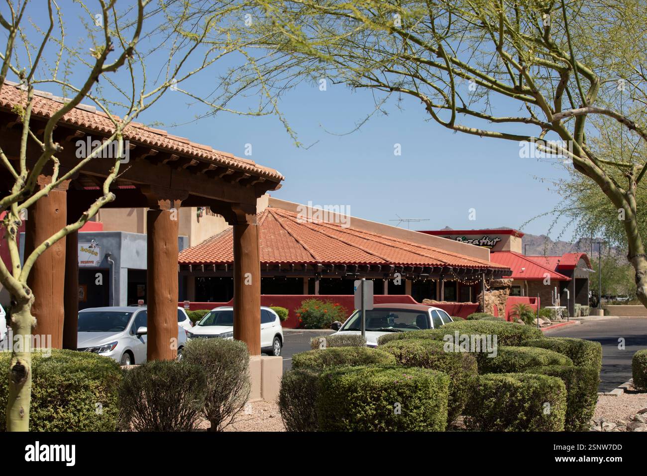 Apache Junction, Arizona, USA - June 1, 2022: Businesses stand in a ...