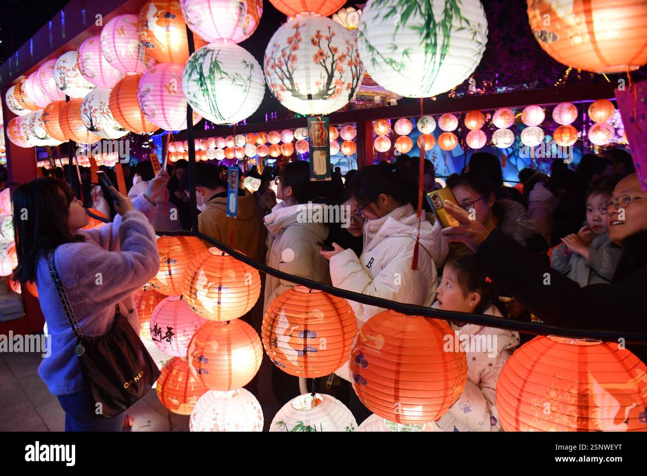 Chengdu,China.12th February 2025. Lanterns illuminate the night sky ...