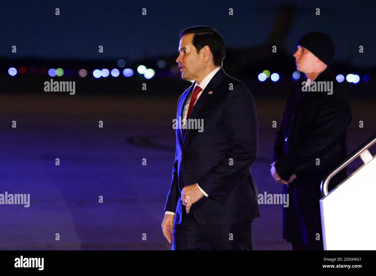 U.S. Secretary of State Marco Rubio disembarks a plane as he arrives ...