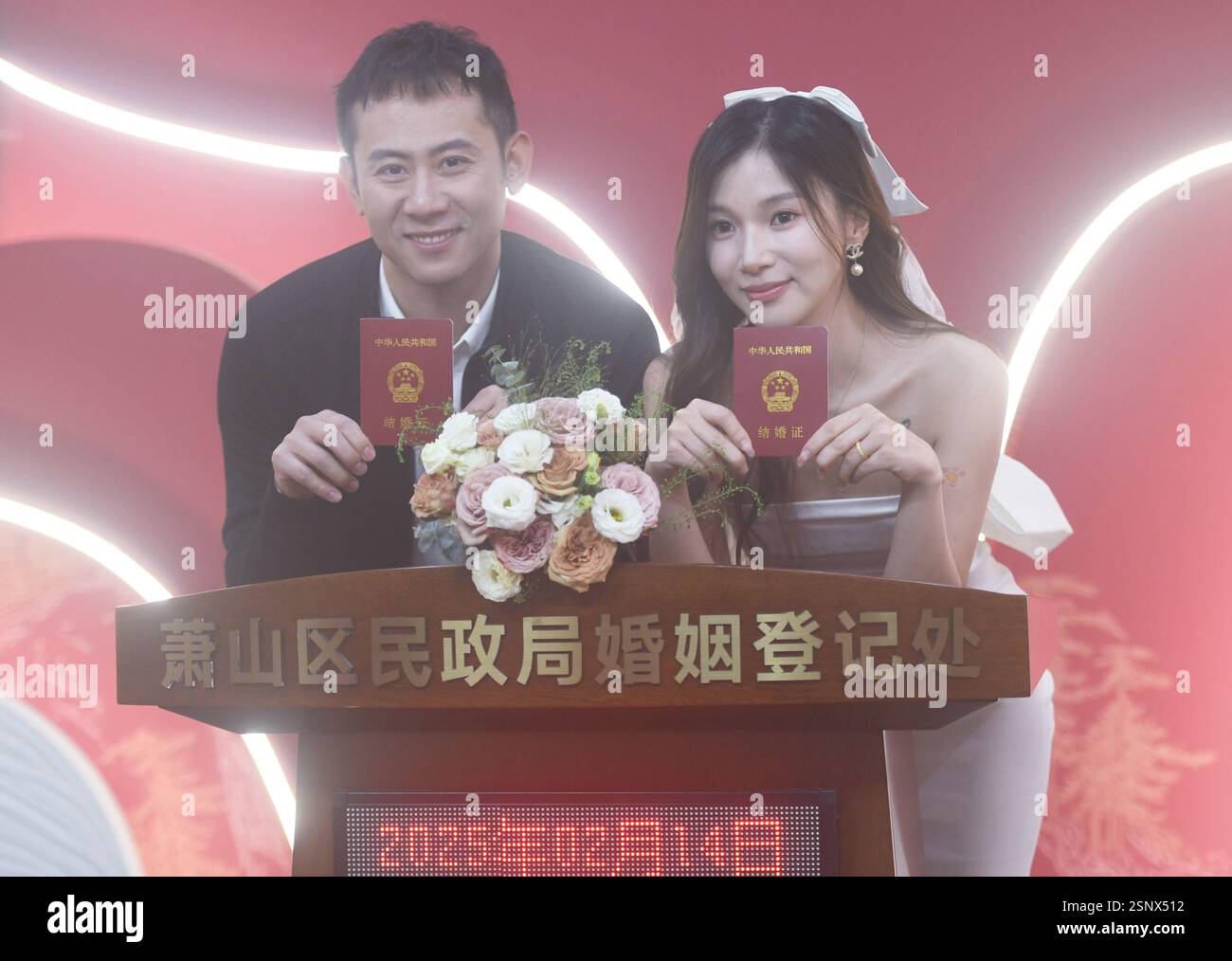 HANGZHOU, CHINA - FEBRUARY 14, 2025 - Couples pose for photos at the ...