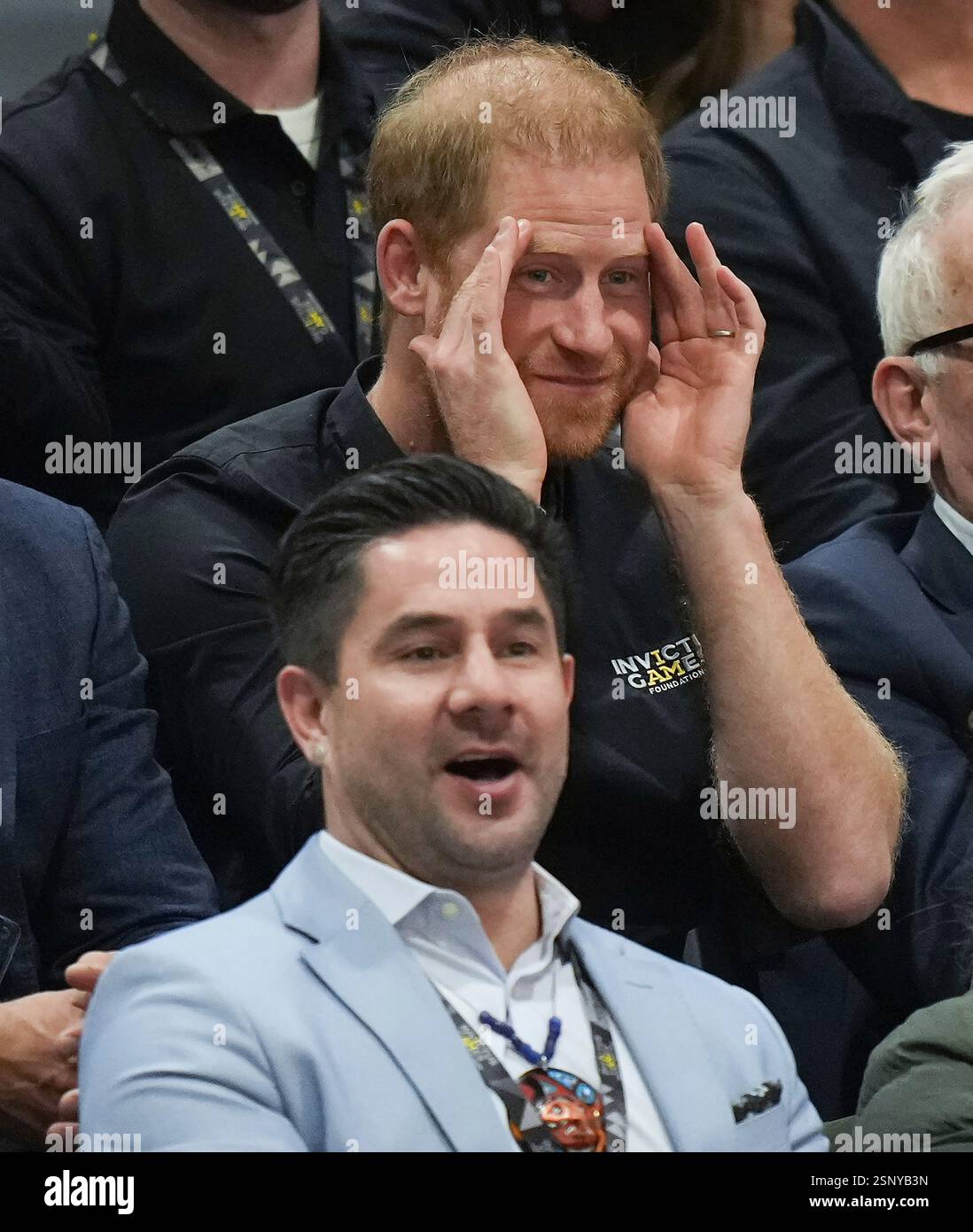 Britain's Prince Harry, the Duke of Sussex, reacts while watching the U ...