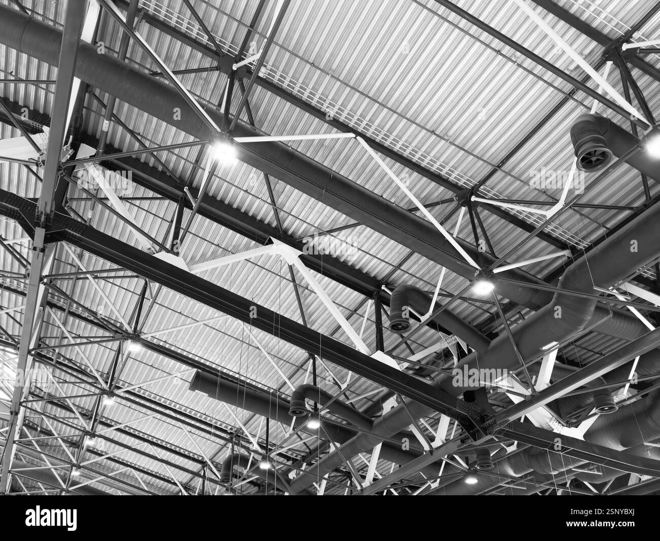 Lights and ventilation system in long line on ceiling of the industrial ...