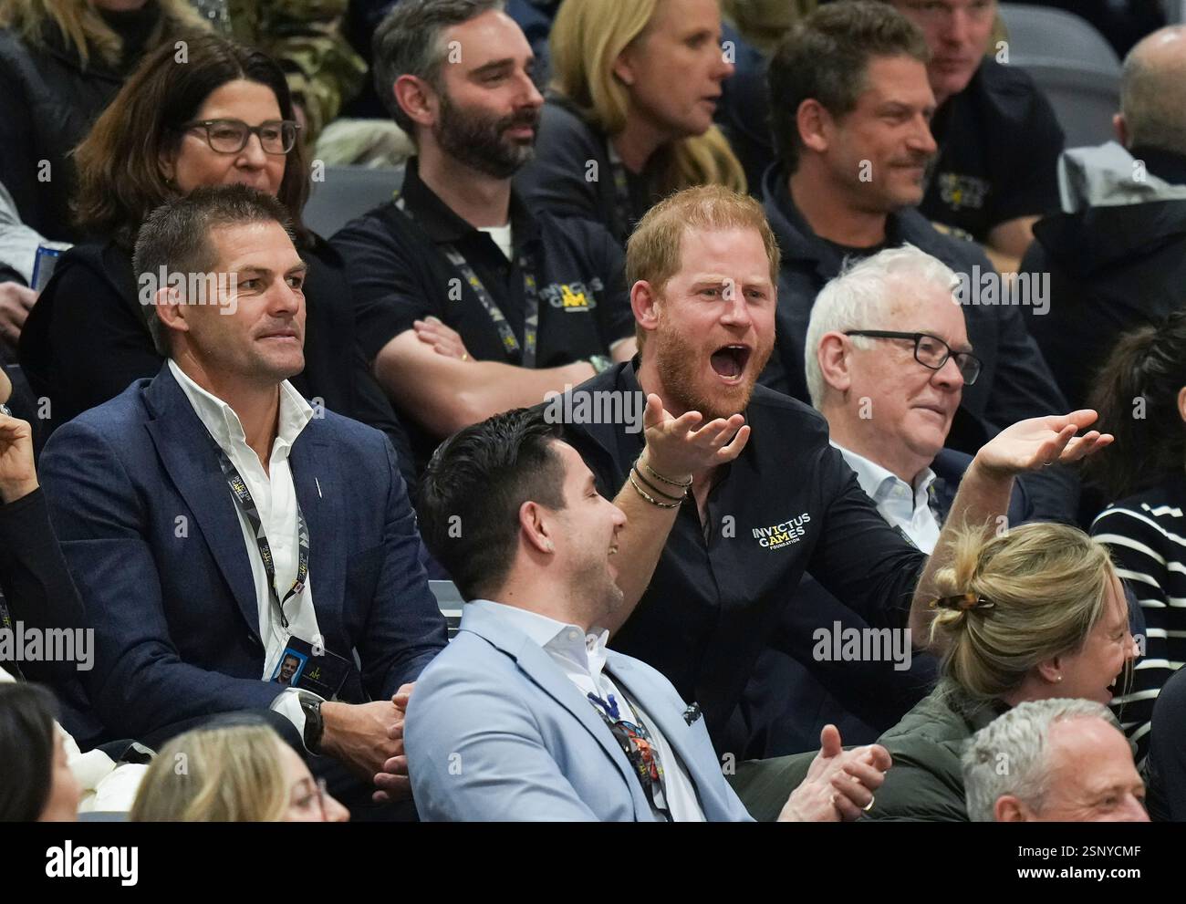 British Prince Harry, center, the Duke of Sussex, sits with retired New ...