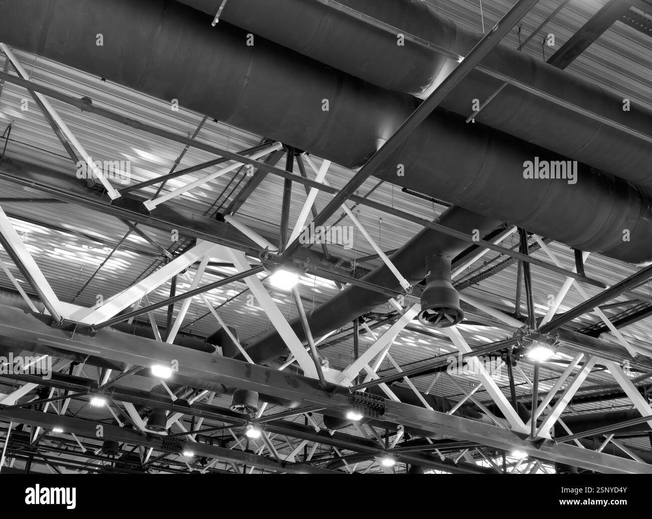 Lights and ventilation system in long line on ceiling of the industrial ...