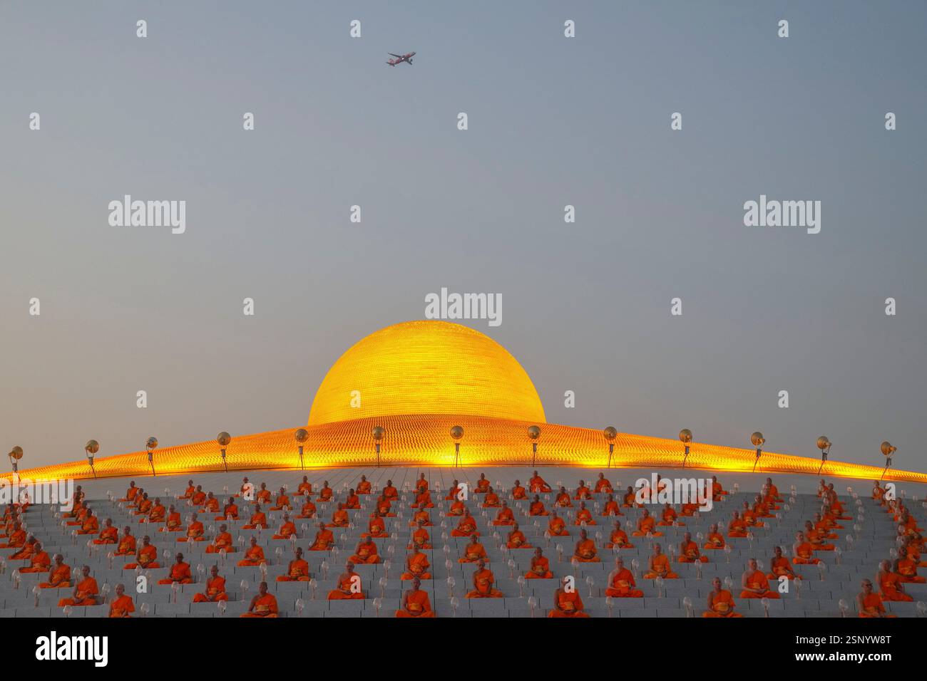 Thai Buddhist monks pray as they gather at Wat Dhammakaya temple to ...