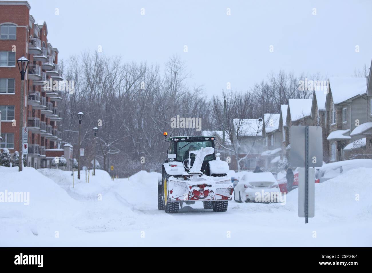 Montreal, Canada. 13th Feb, 2025. A municipality worker removes snow ...