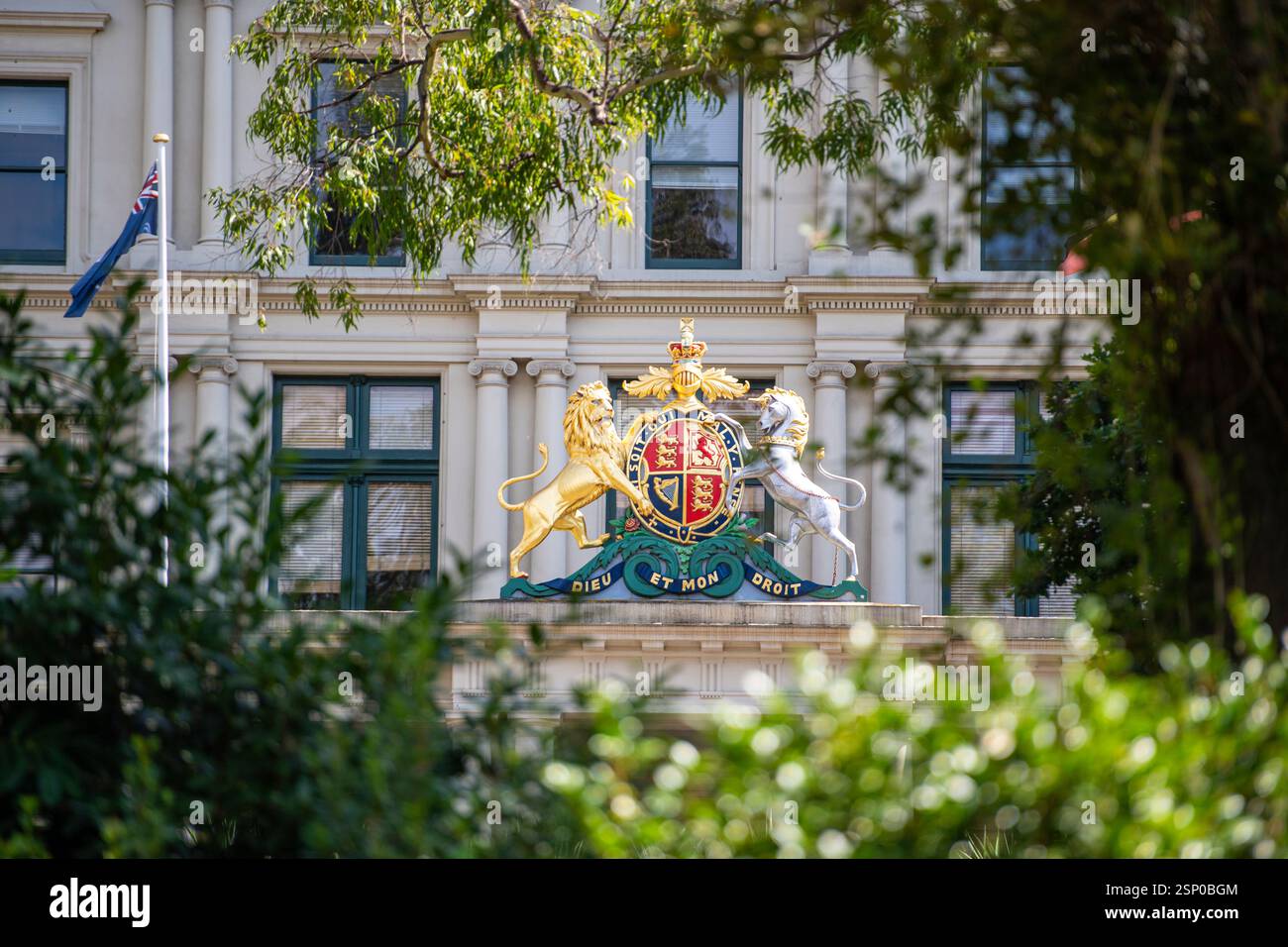 Gold lion, silver horse, shield, coat of arms of monarch of UK bearing ...