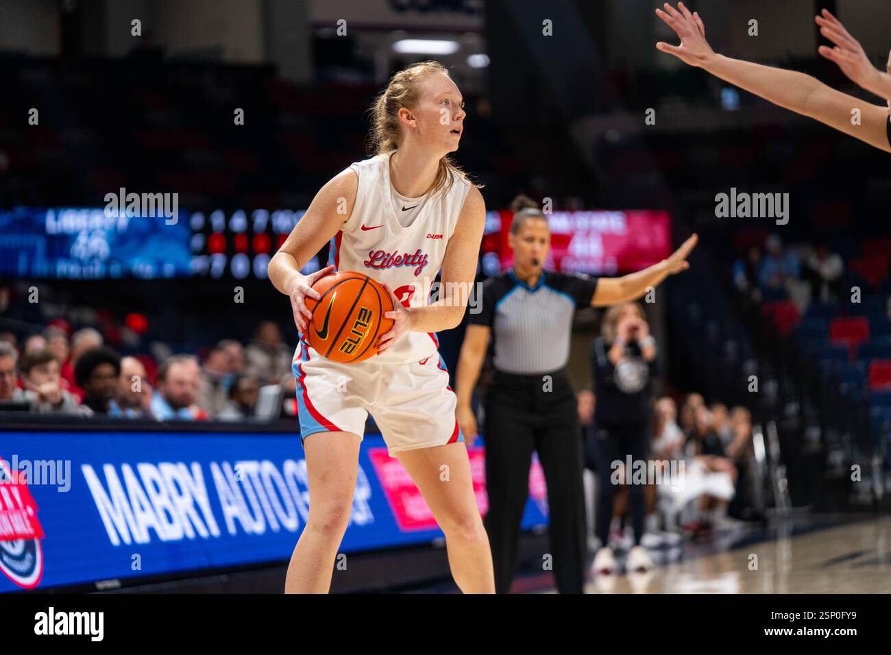 Emma Hess #23 of the Liberty Lady Flames looks for a teammate to pass ...