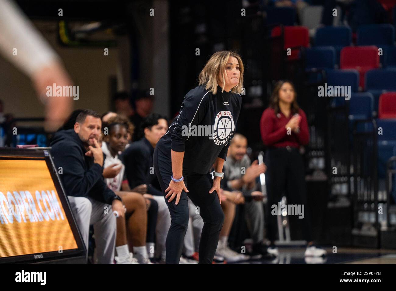Head coach Jody Adams of the New Mexico State Aggies looks on during a ...