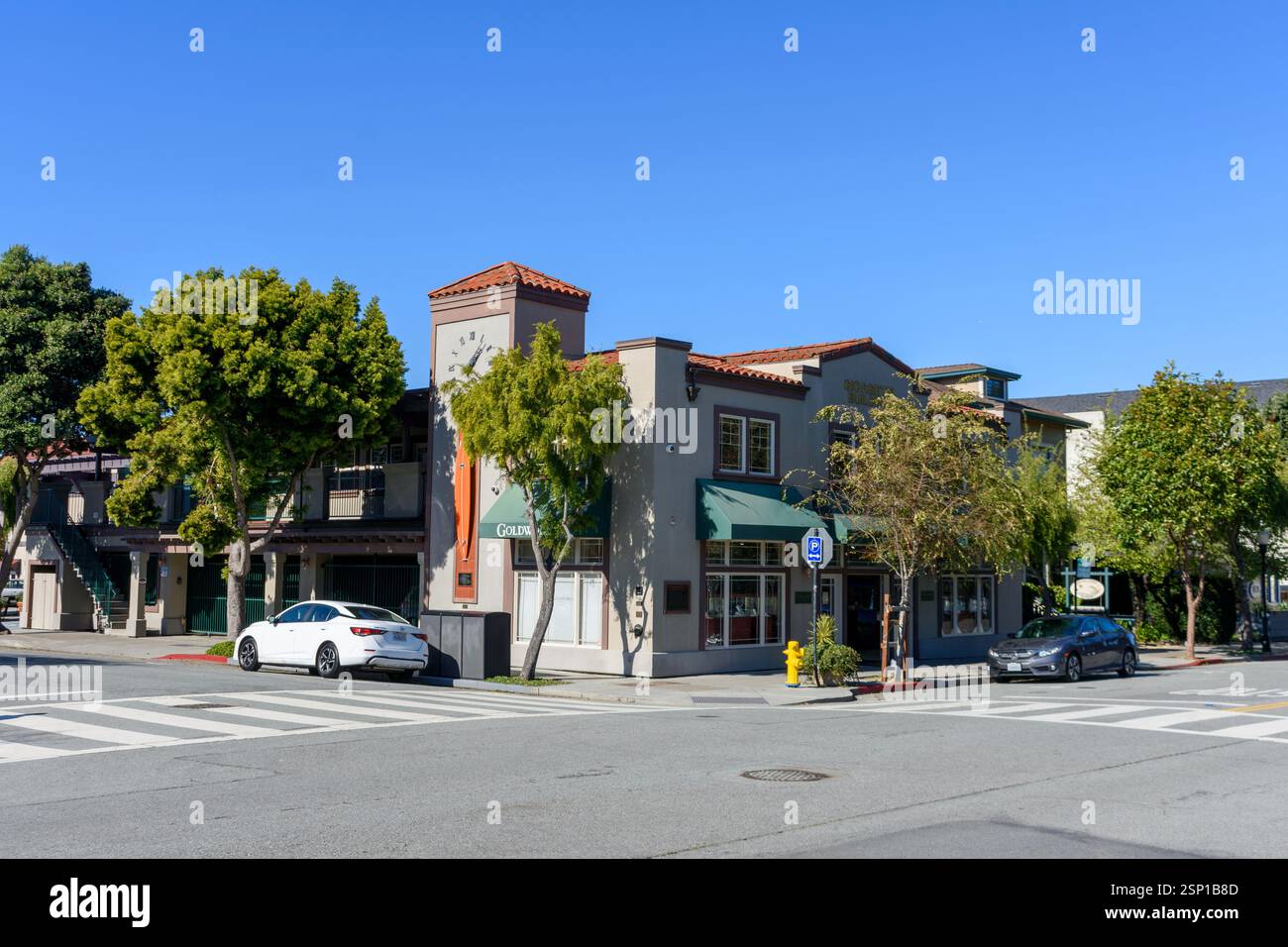 Urban streetscape with a two-story commercial building with terracotta ...