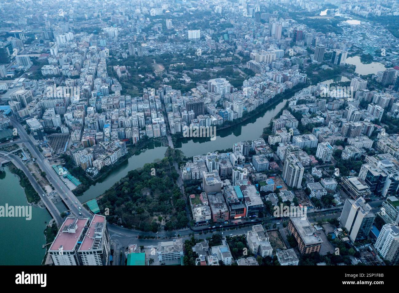 A stunning aerial view of Dhaka’s Gulshan area, featuring Gulshan Lake and its surrounding urban ...