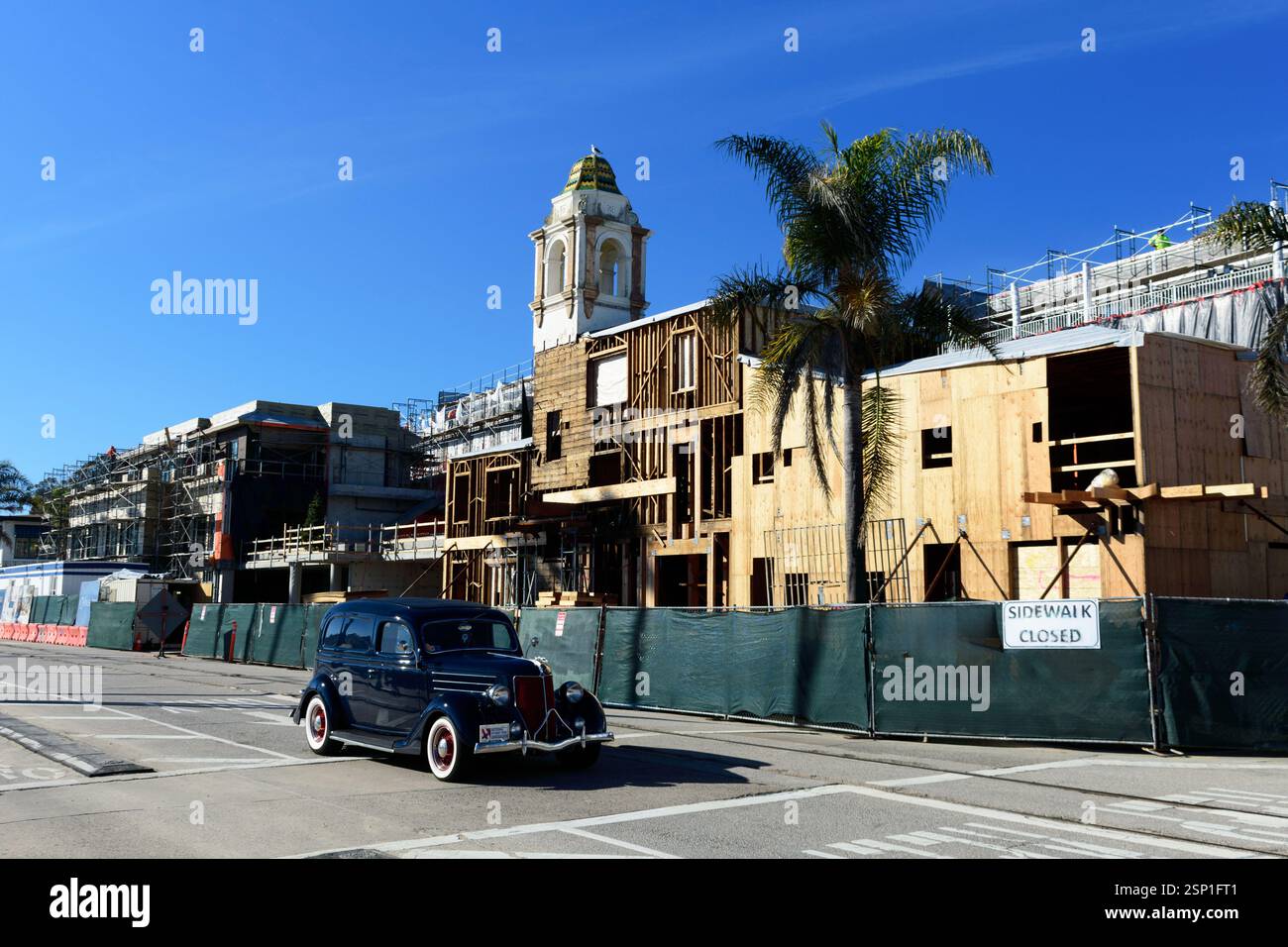 1935 Ford Model 48 sedan vehicle drives past La Bahia Hotel ...