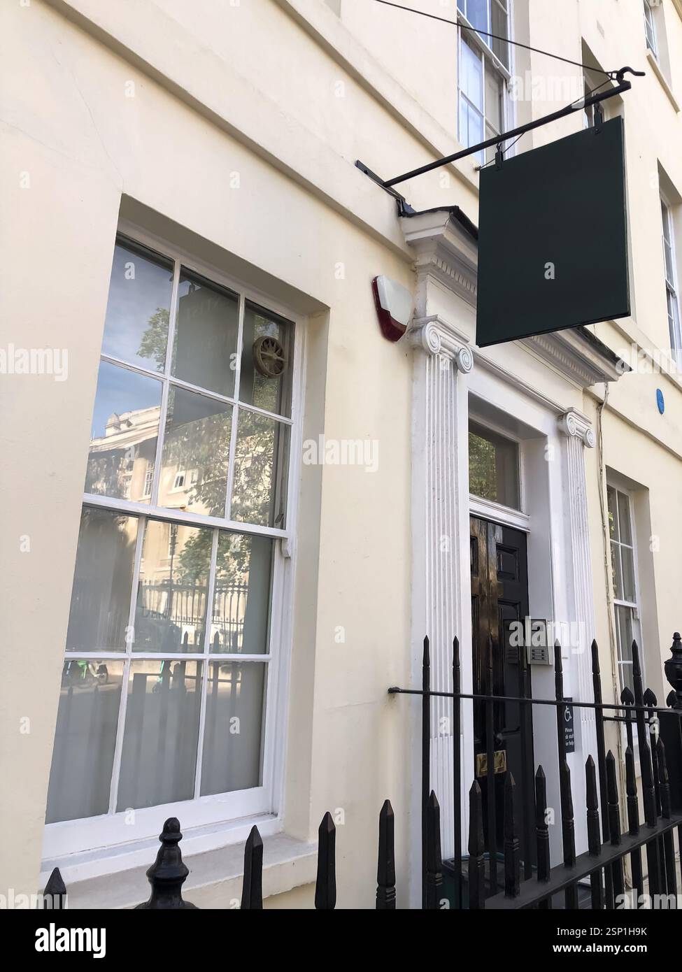 Commercial building in England, located on small street in morning ...