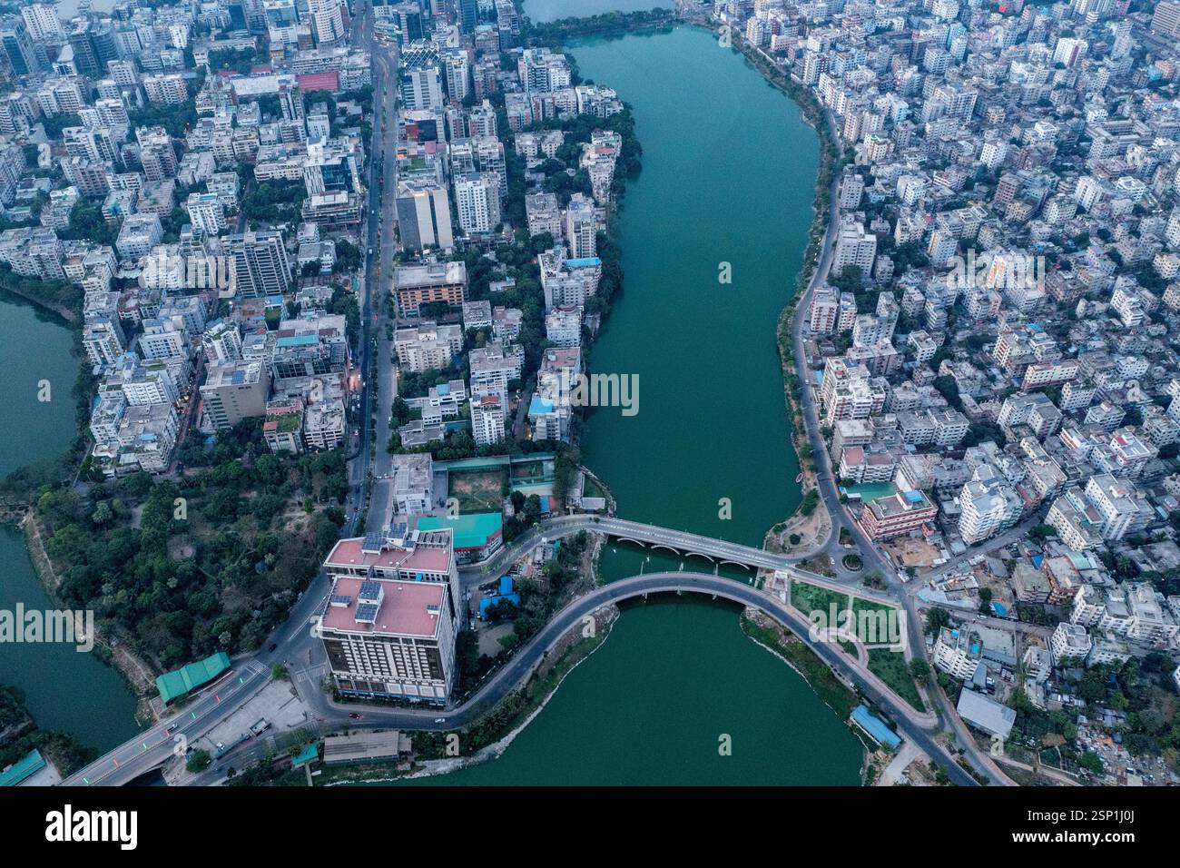 A stunning aerial view of Dhaka’s Gulshan area, featuring Gulshan Lake and its surrounding urban ...