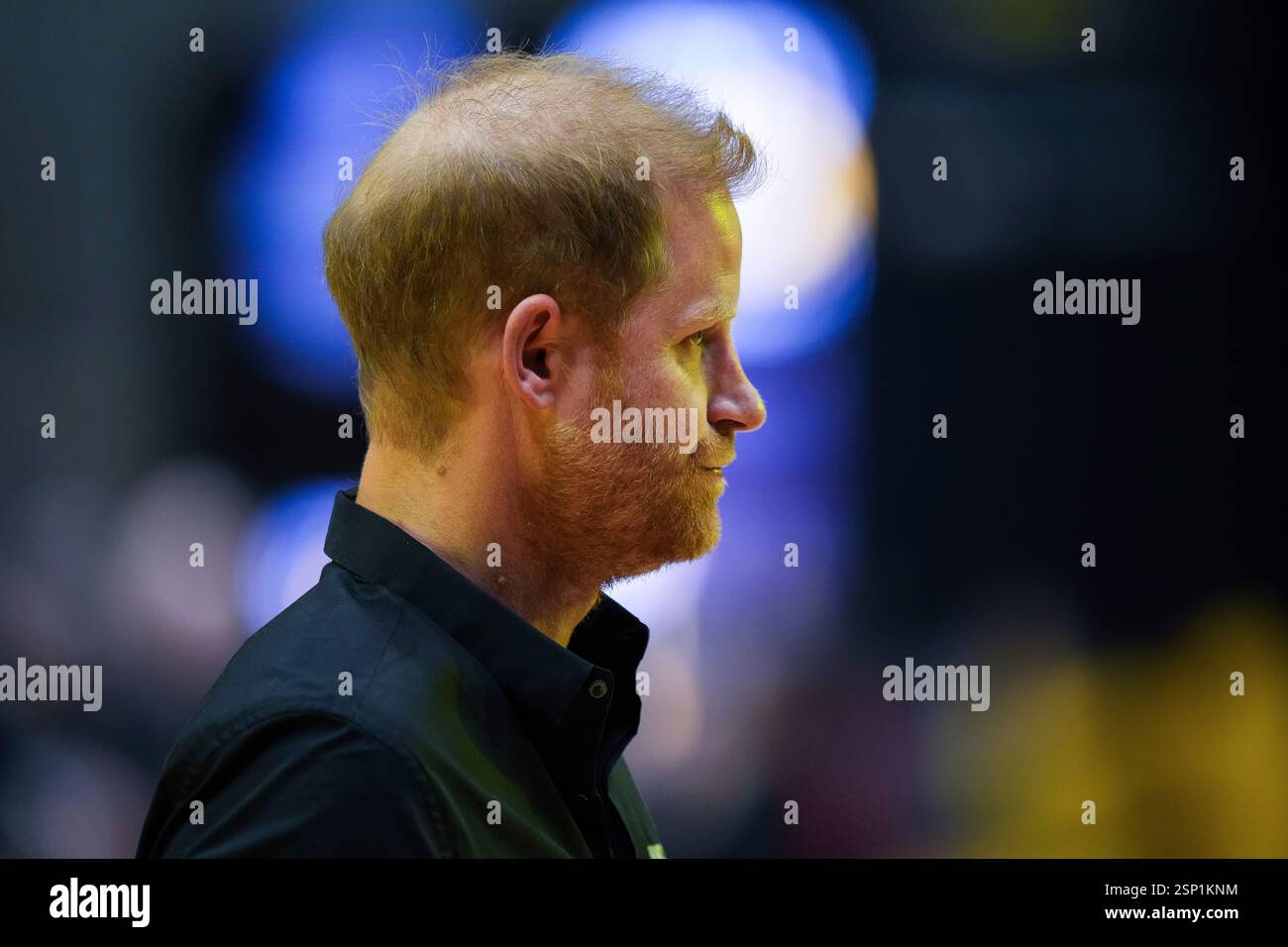 Britain's Prince Harry, the Duke of Sussex, prepares to hand out gold ...
