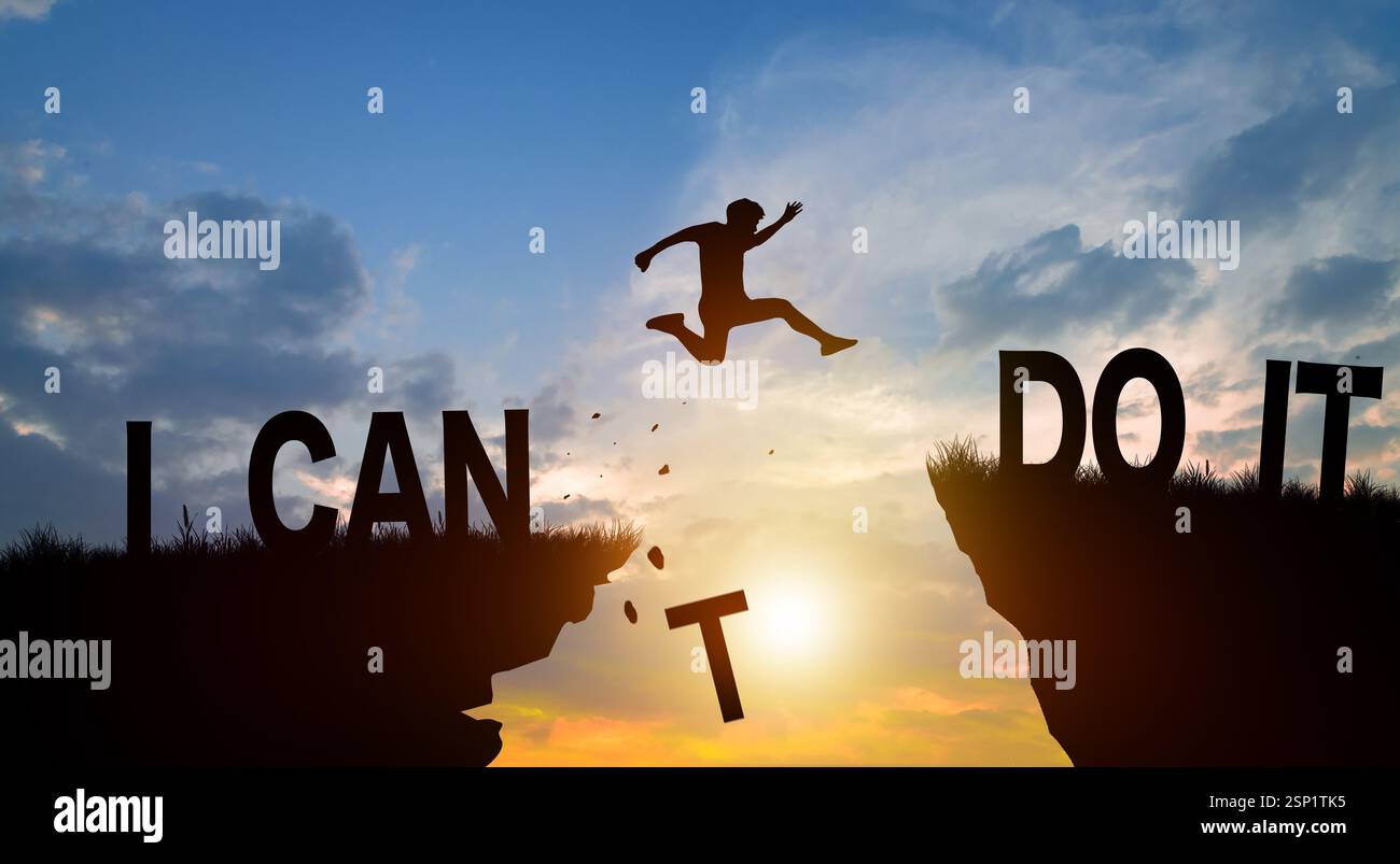 Silhouette man jumping over I can do it wording on cliffs with cloud ...