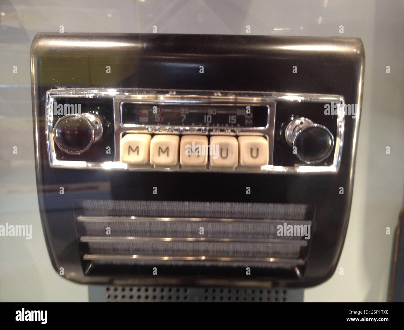 Vintage car radio. Sleek black exterior with gleaming chrome accents. A ...