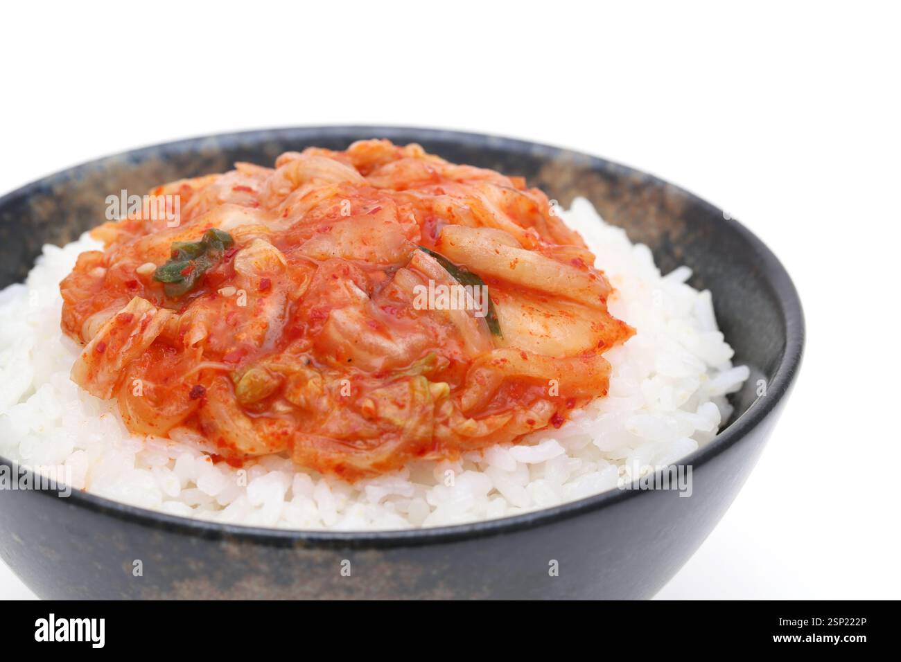 Korean kimchi with cooked white rice in a bowl on white background ...