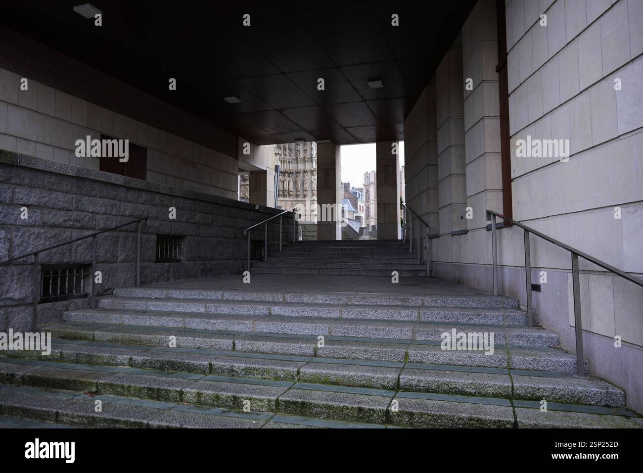 A modern covered passage with stone steps and railings in Amiens ...
