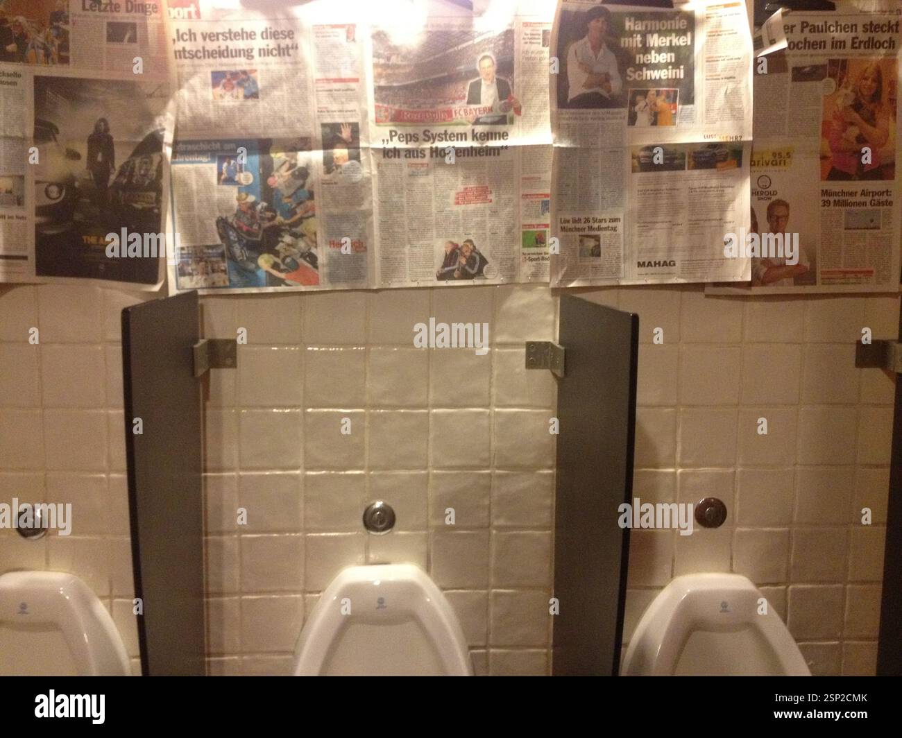 Public restroom, Germany, Munich. Urinals surrounded by walls entirely ...