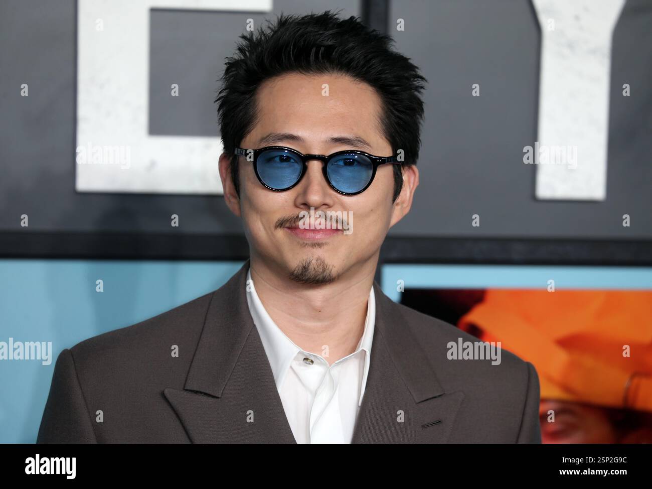Steven Yeun attends the "Mickey 17" World Premiere at Cineworld ...